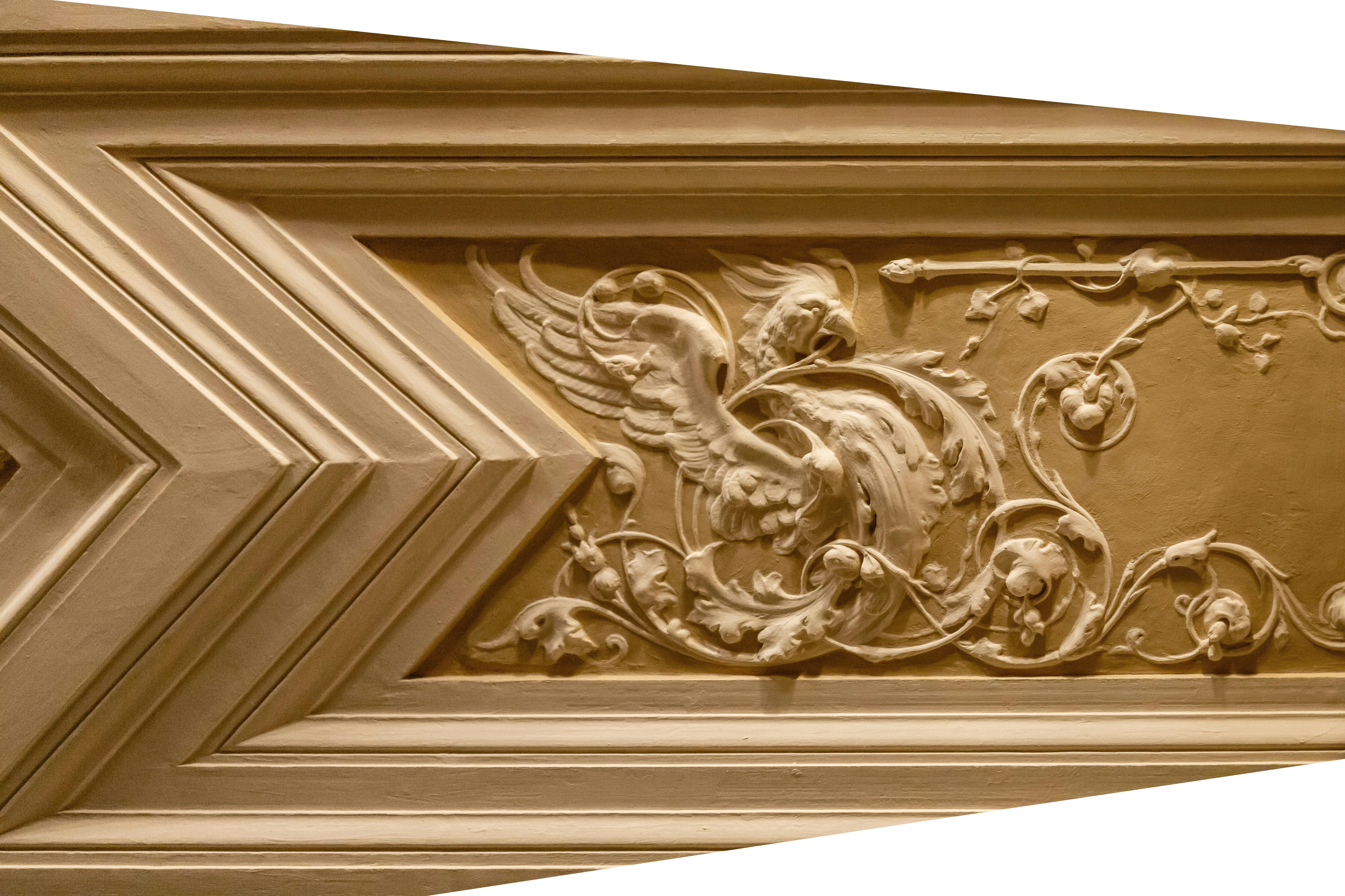 Ornate Architectural Relief in Warm Sepia Tones