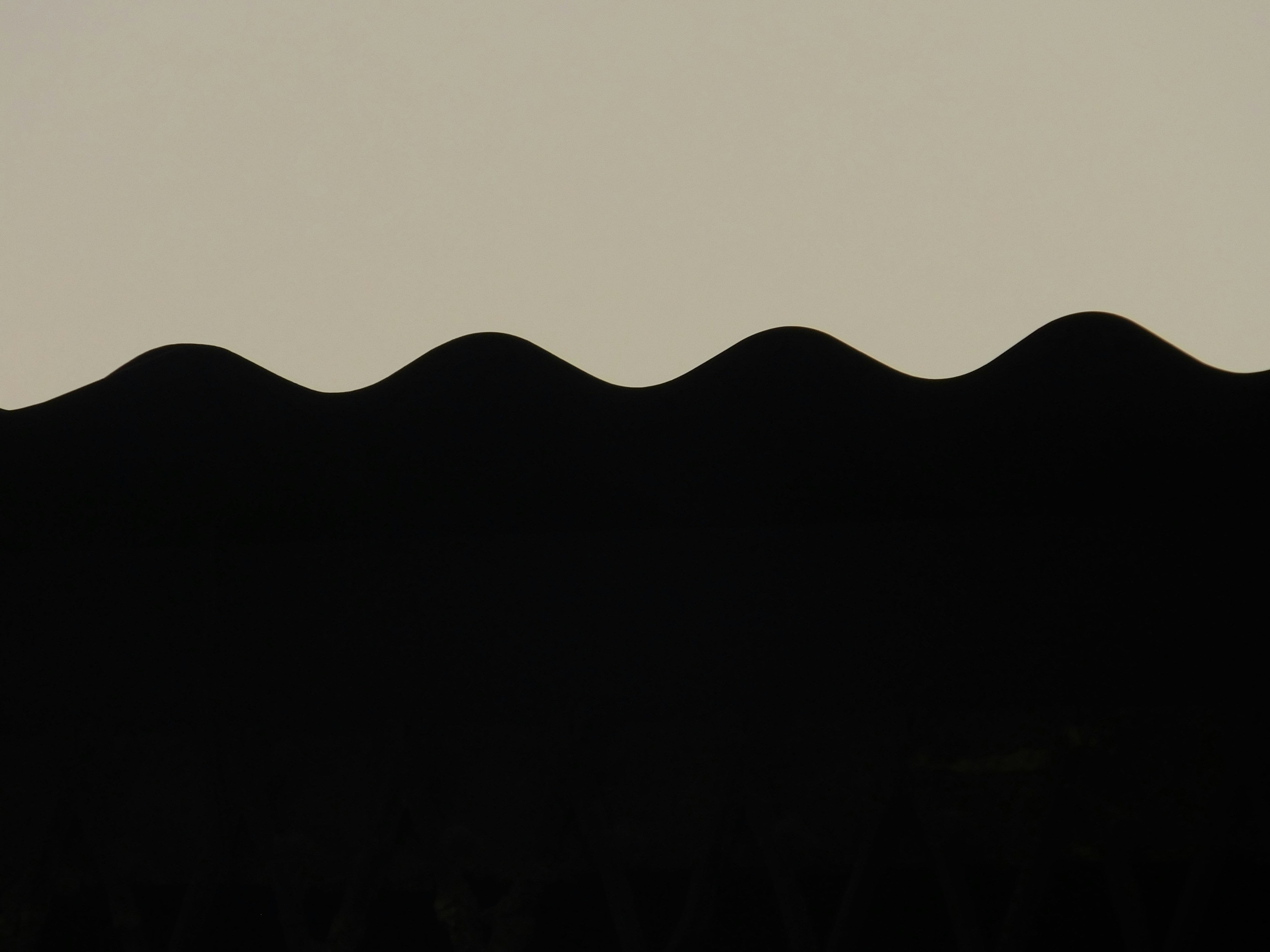 Scalloped Dusk: A Quiet Horizon of Wave-Like Dunes
