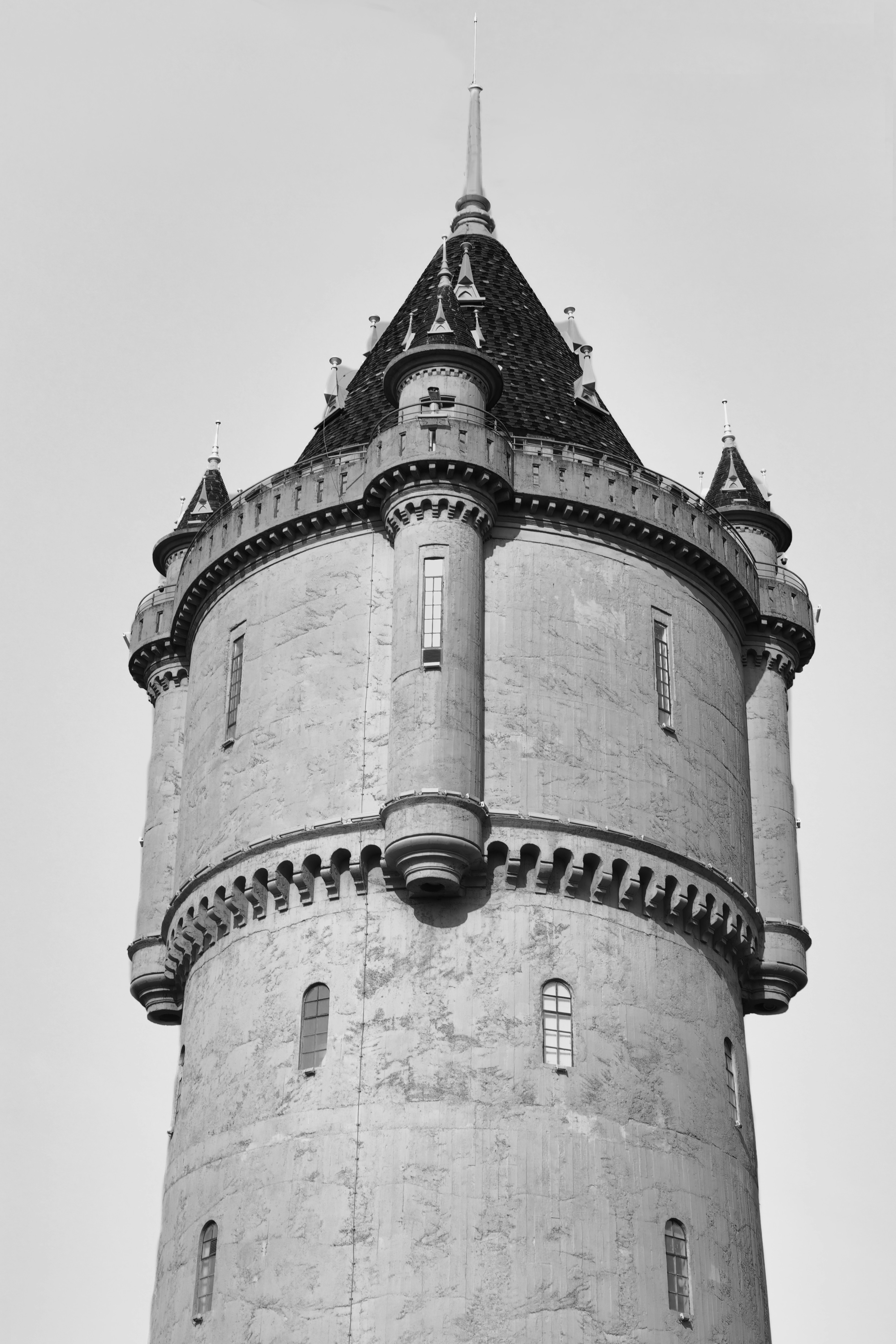 Monochrome Sentinel: The Circular Tower Crowned with Spires