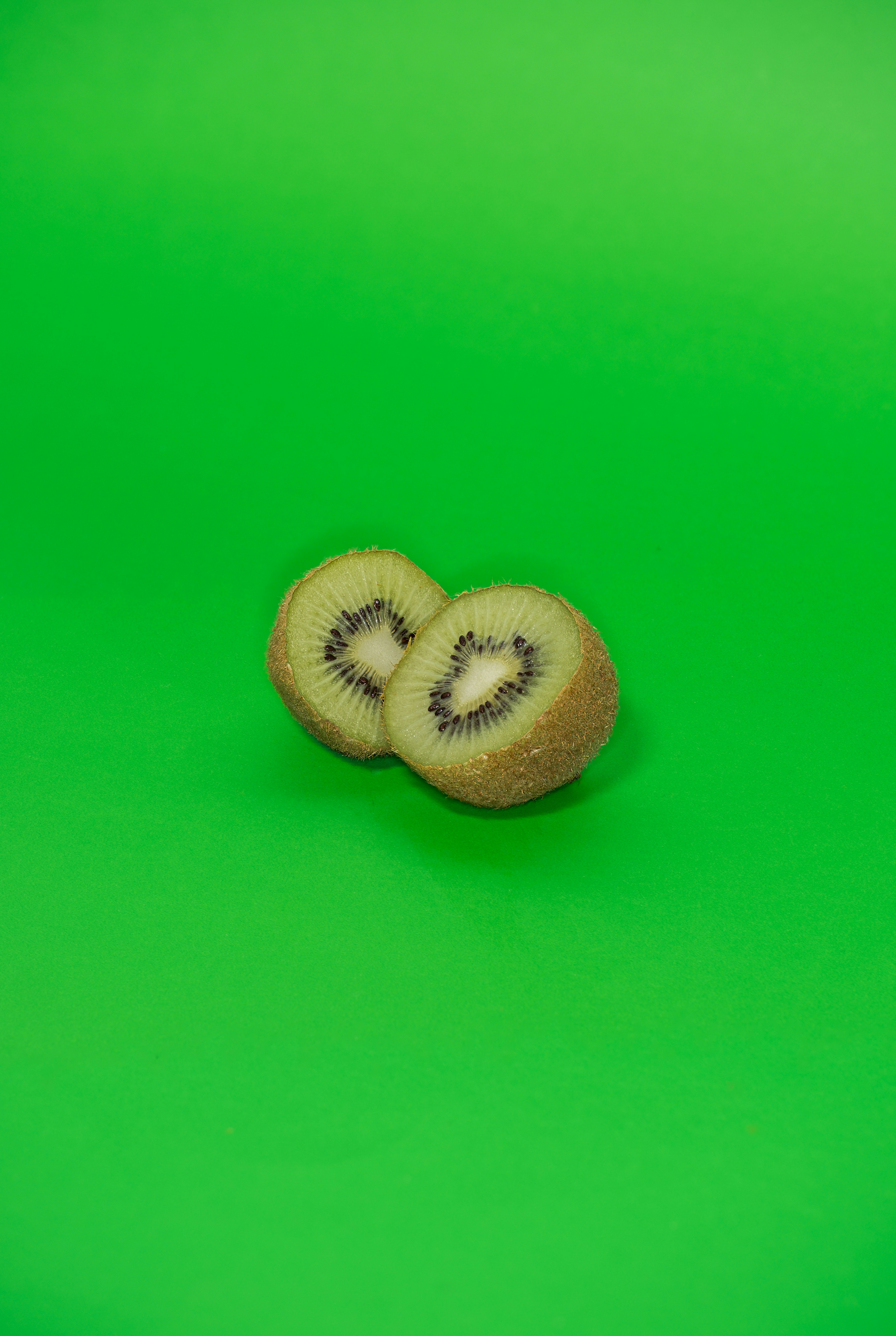 Kiwi Duo on a Neon Stage: A Citrus-Soft Glow