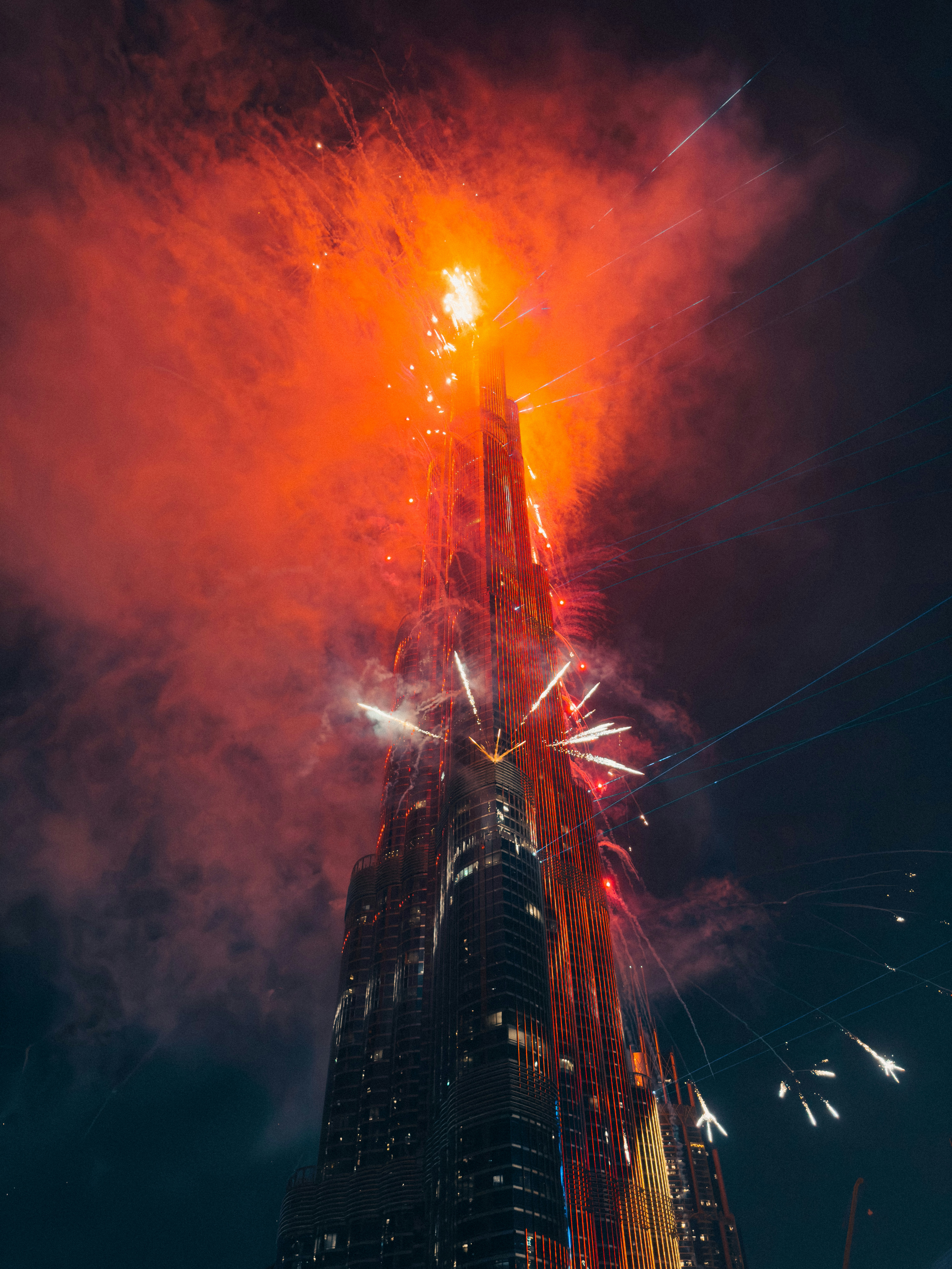 A very tall building with fireworks in the sky photo – Free Burj ...