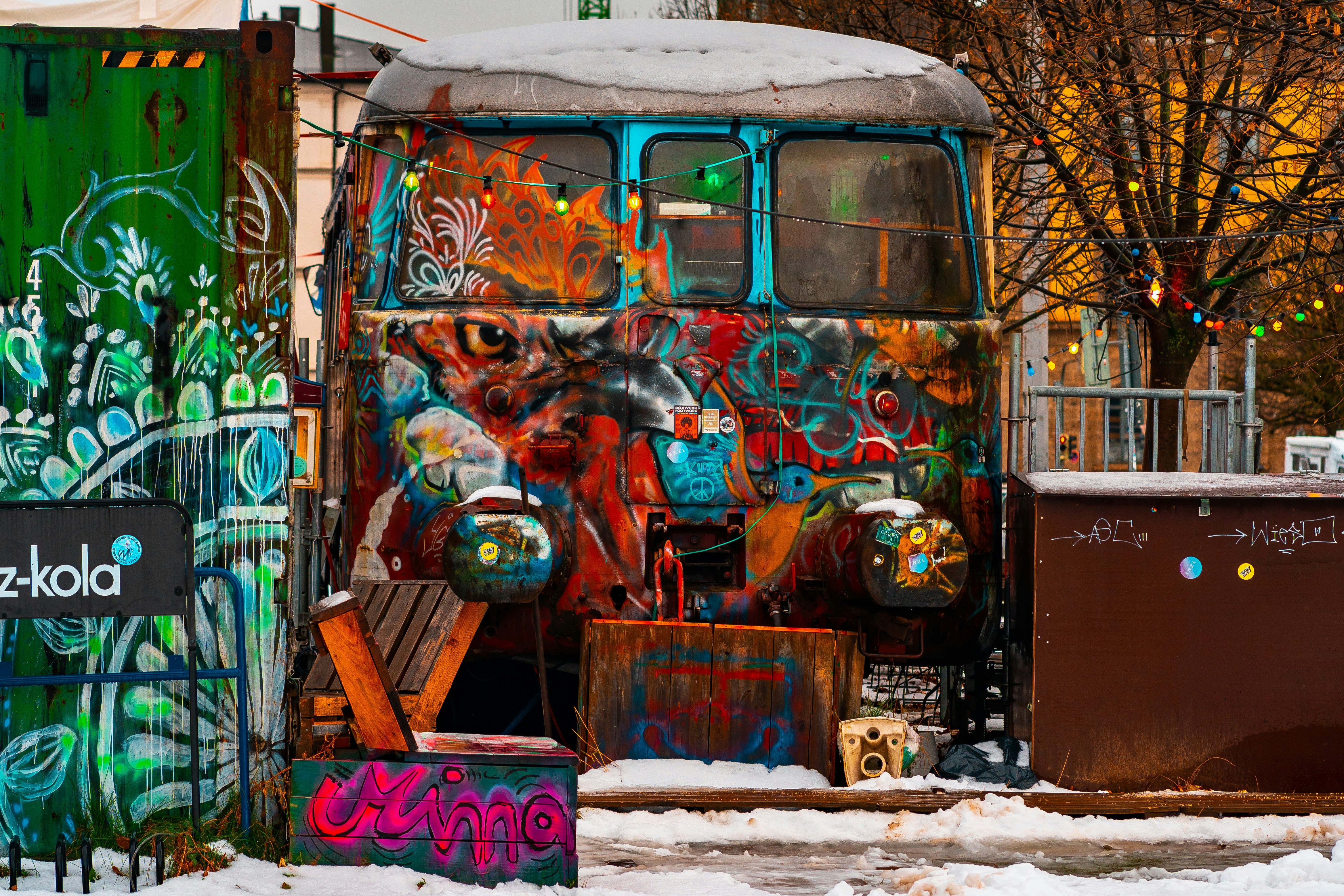 Snow-Dusted Graffiti Engine: A Vivid Train Car Immersed in Urban Color
