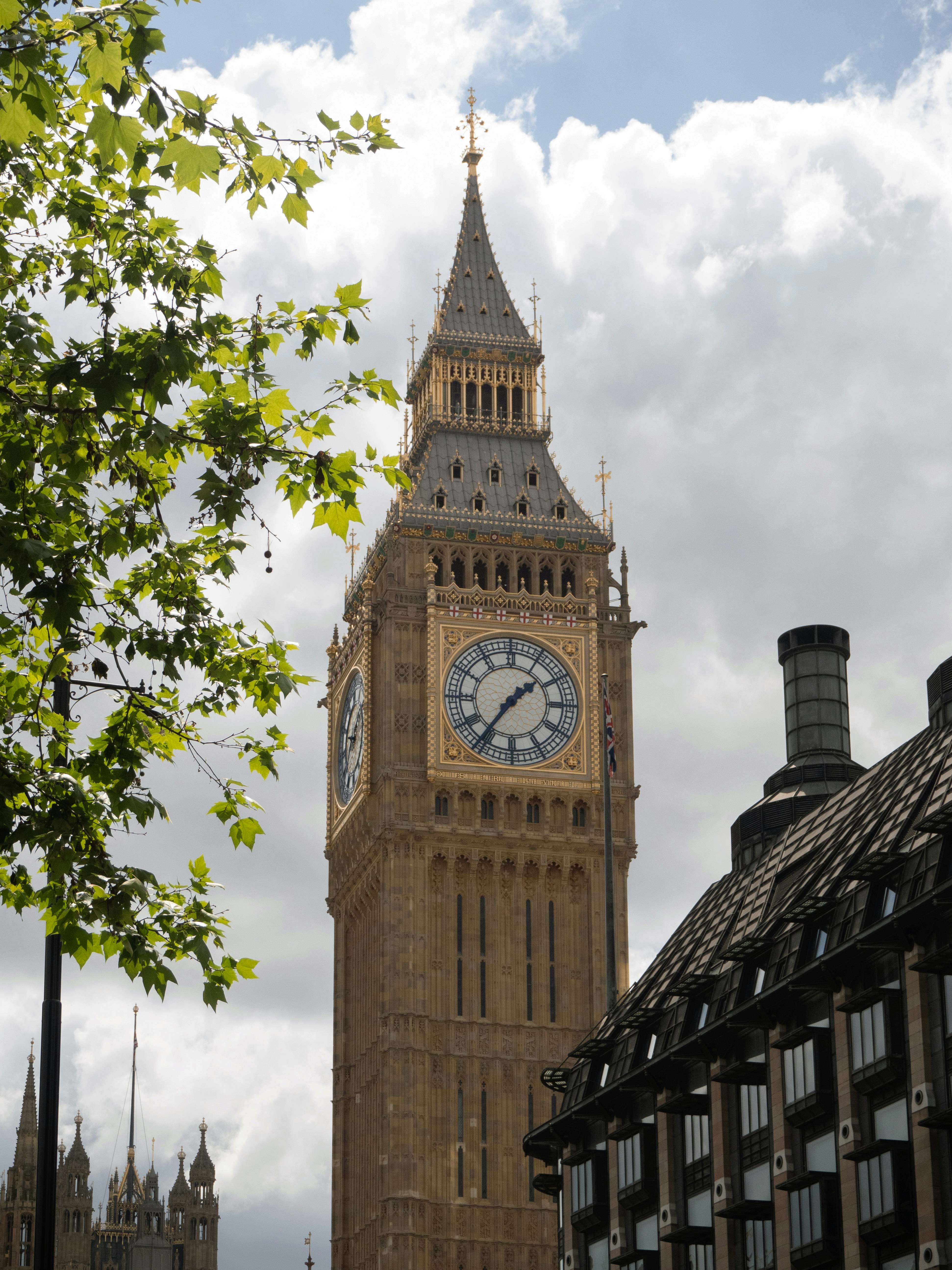 A tall clock tower towering over a city photo – Free London Image on ...