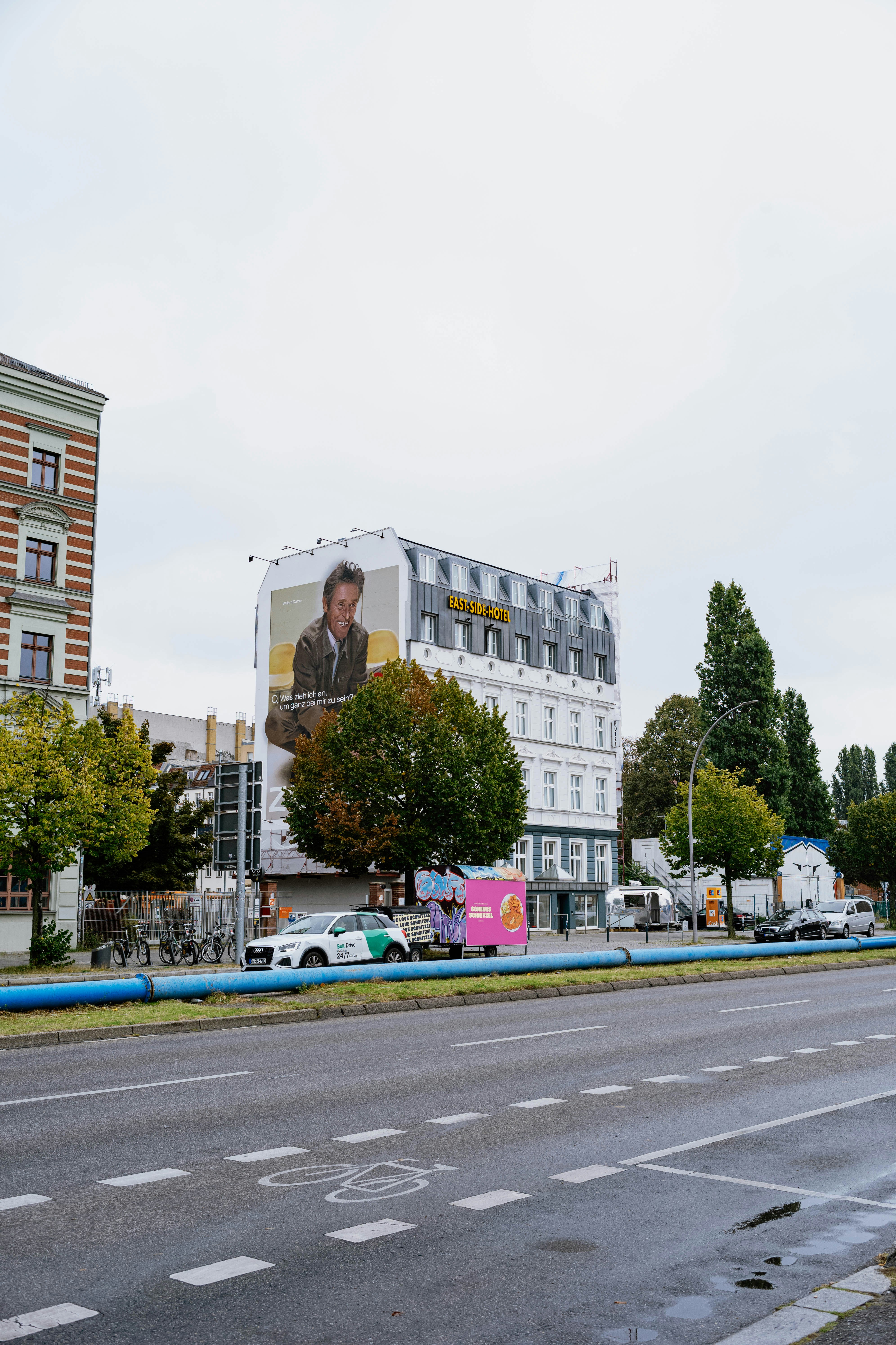 A city street with a large billboard on the side of the road photo ...