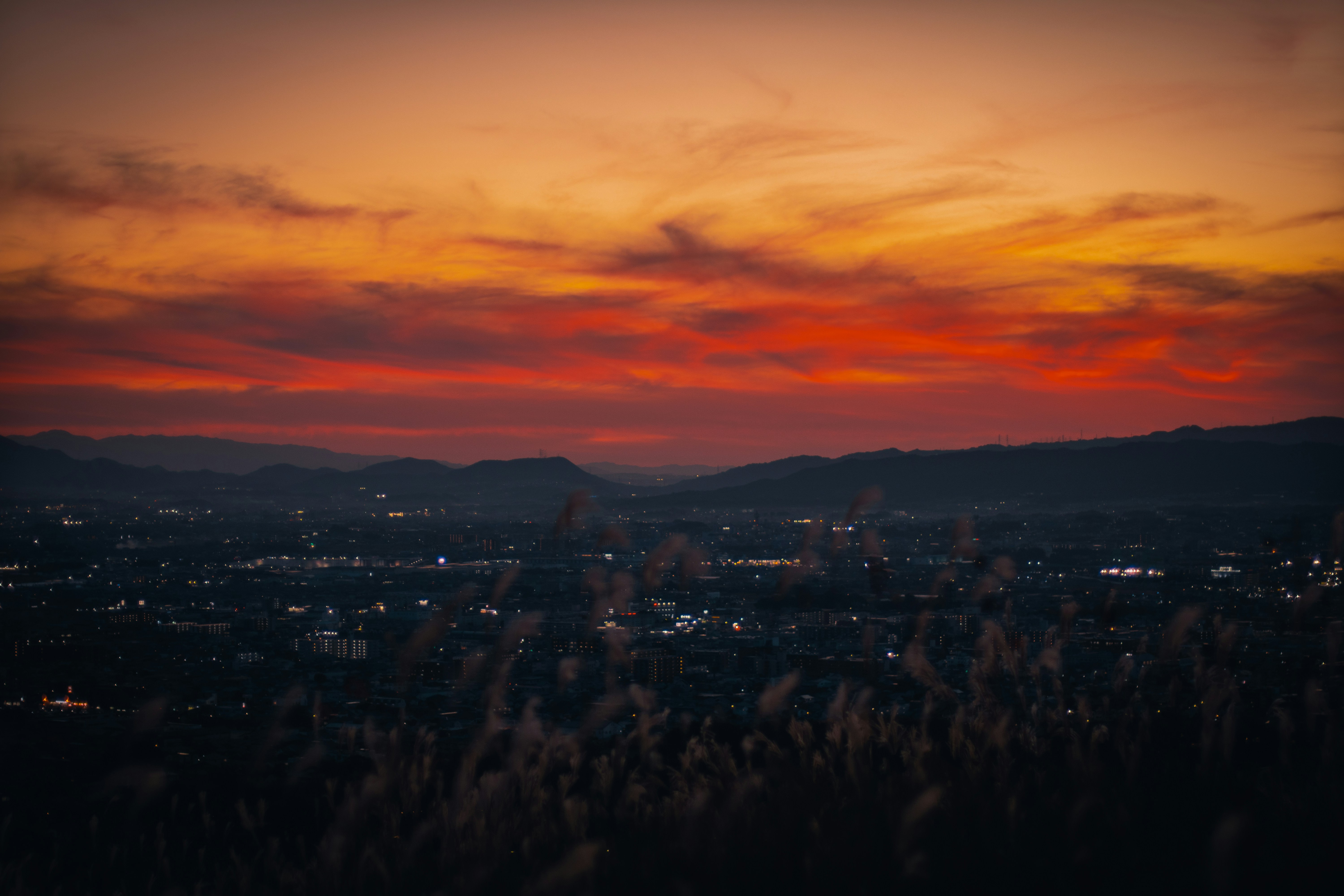 A view of a sunset over a city photo – Free Sunset Image on Unsplash