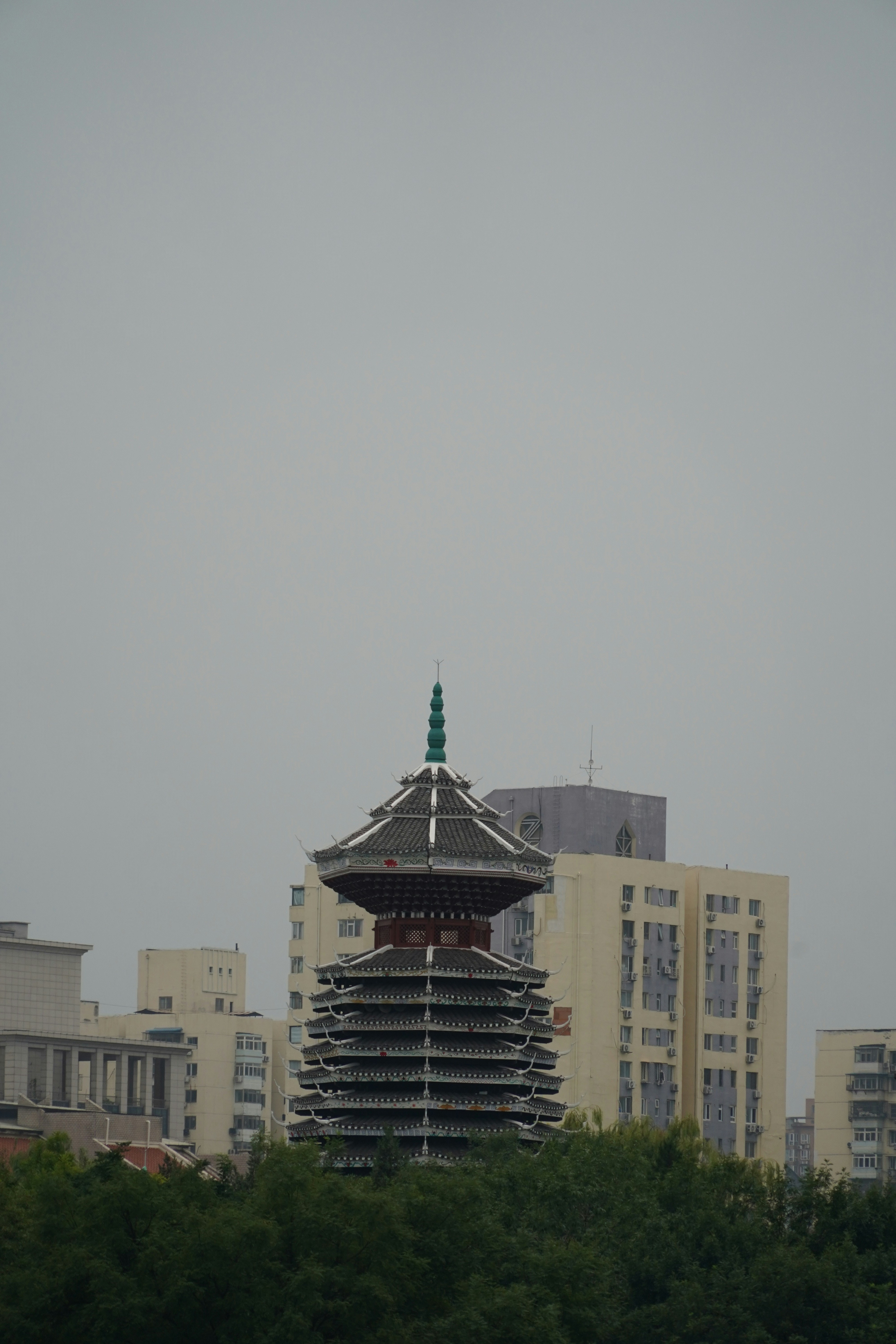 A clock tower in the middle of a city photo – Free Beijing olympic park ...