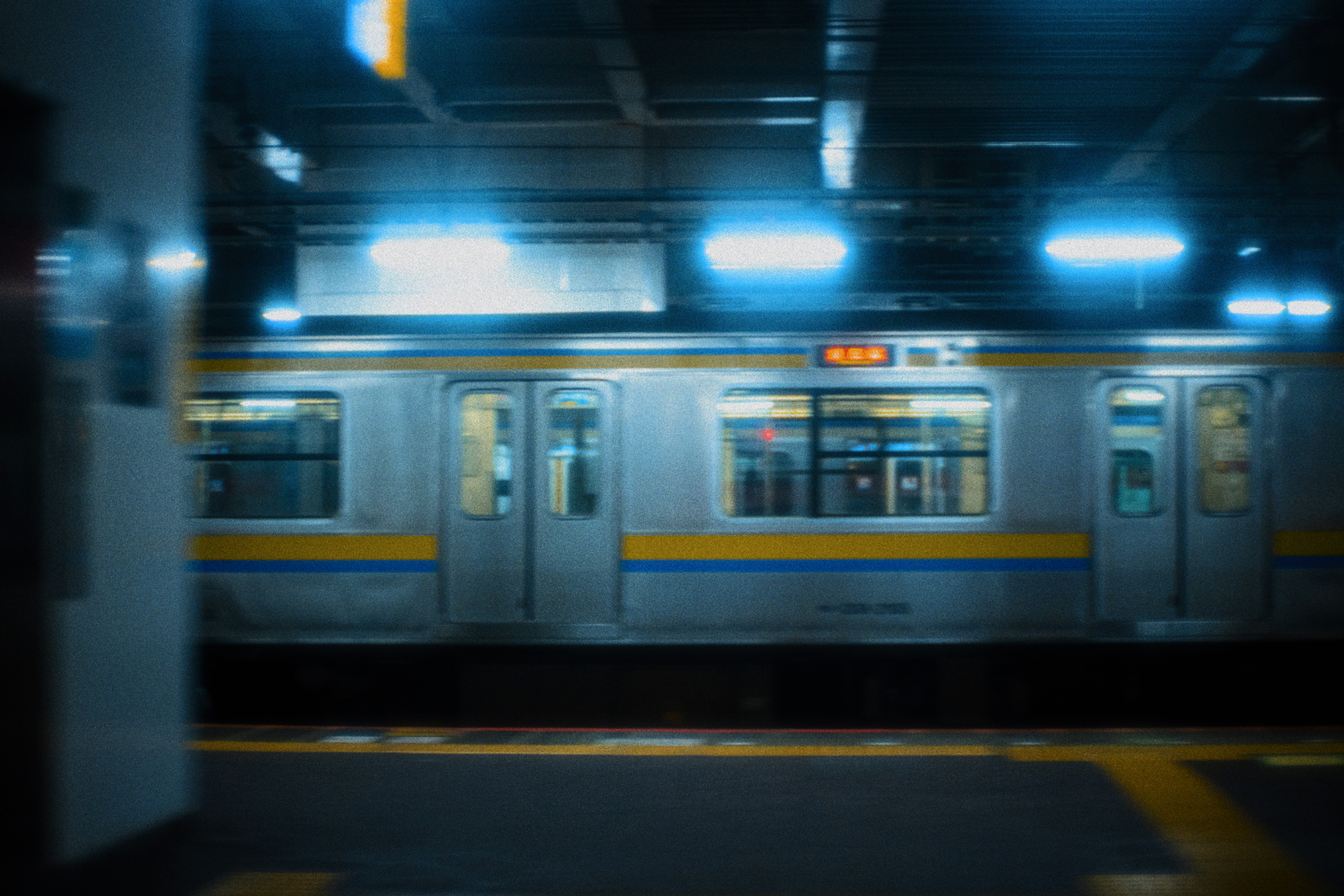 A subway train in a subway station at night photo – Free Rail Image on ...