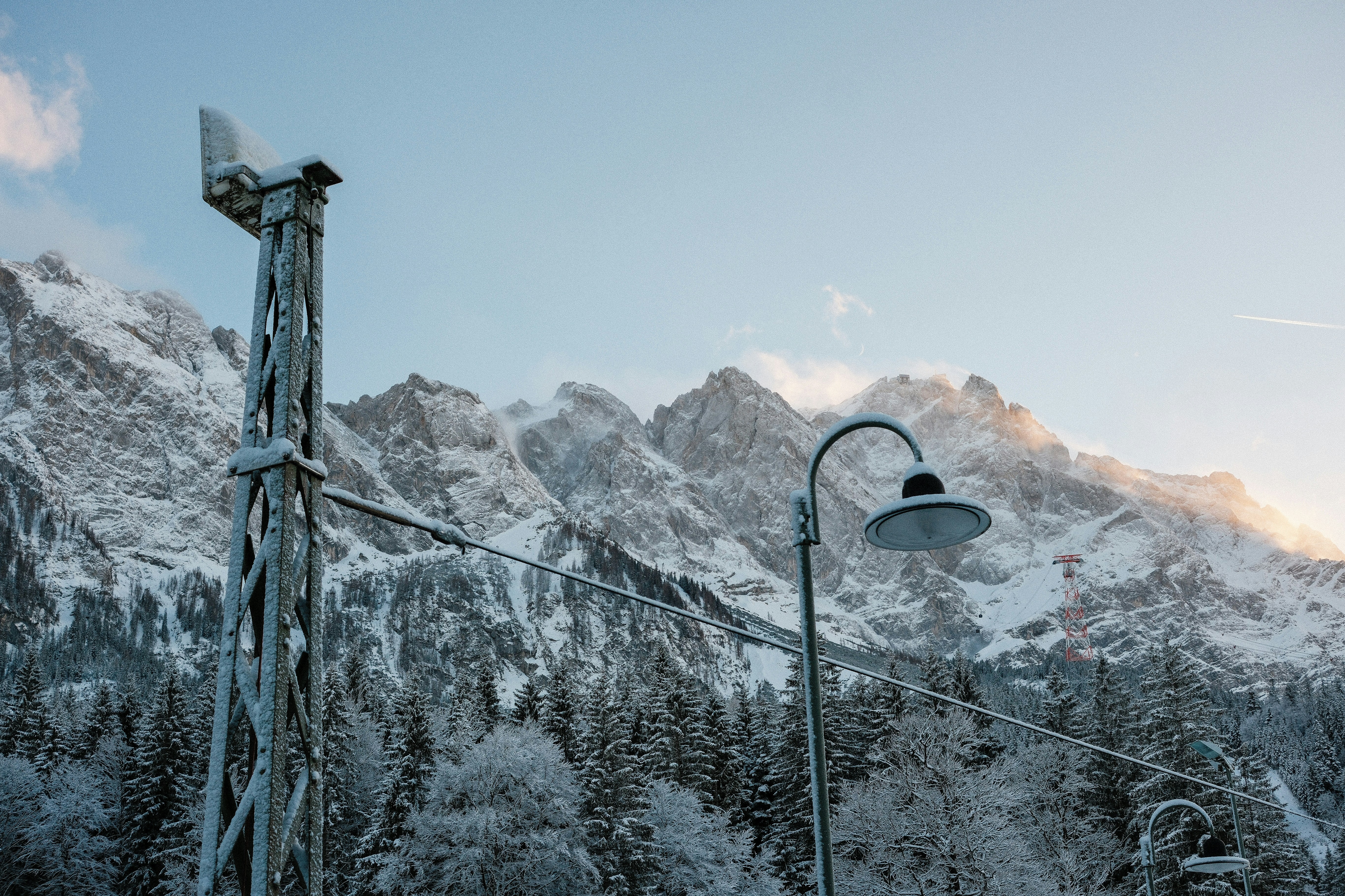 Curved Lamp Against a Snowbound Alpine Dawn