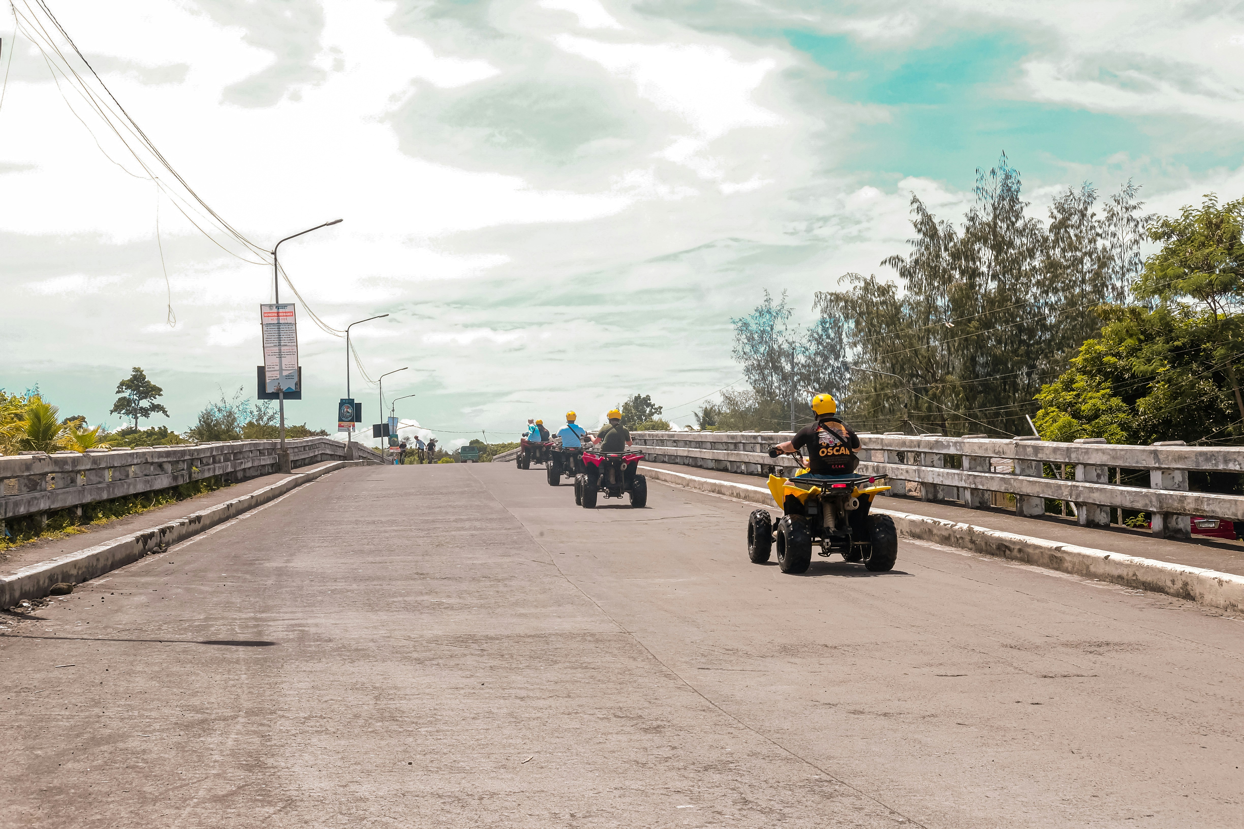 A group of people riding motorcycles down a road photo – Free Bicol ...