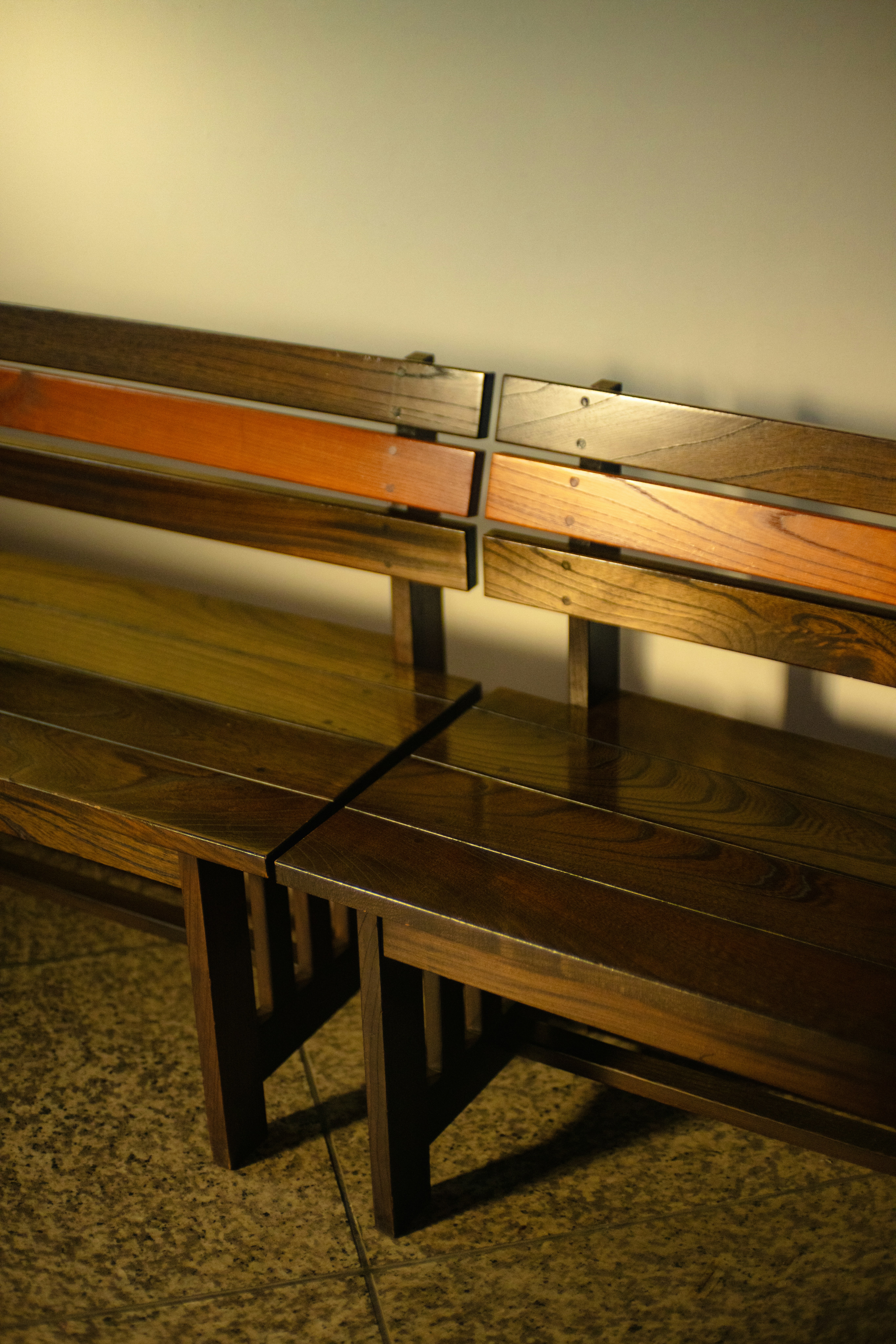 Interlocking Benches Under Warm Evening Light: A Study in Wood, Light, and Perspective