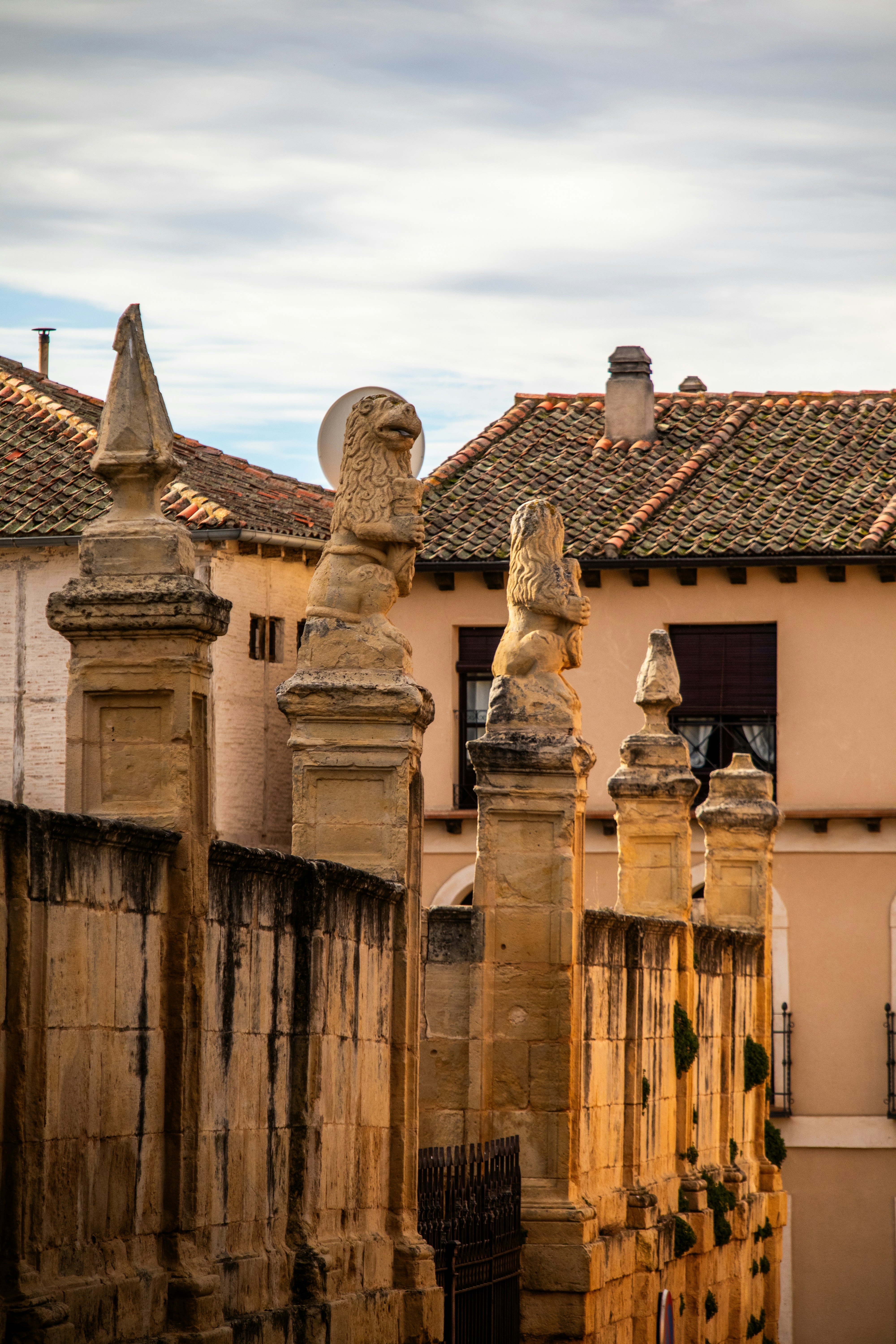 A row of buildings with statues on top of them photo – Free Building ...