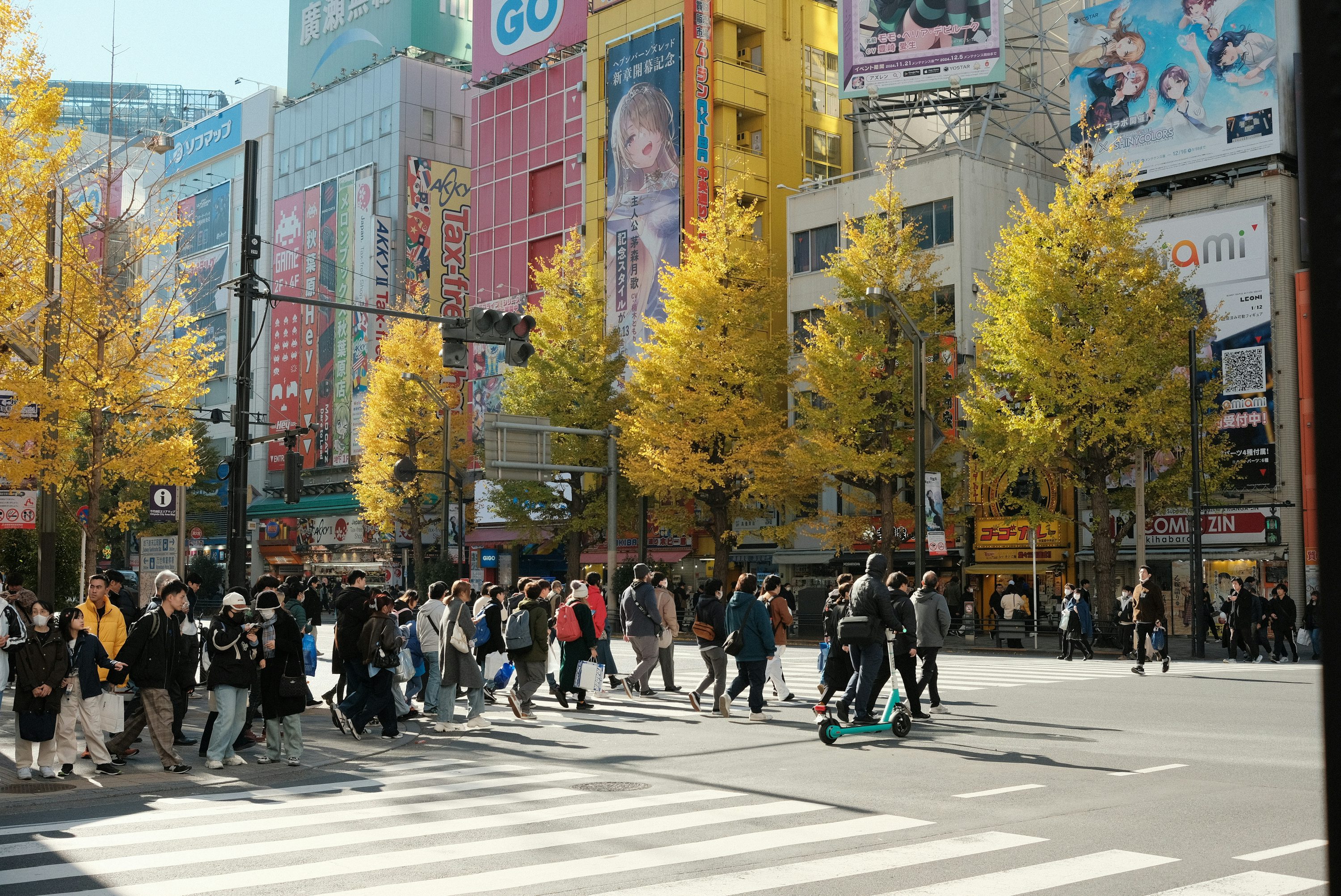 A crowd of people walking across a street photo – Free Tokyo Image on ... A crowd of people walking across a street photo – Free Tokyo Image on ...
