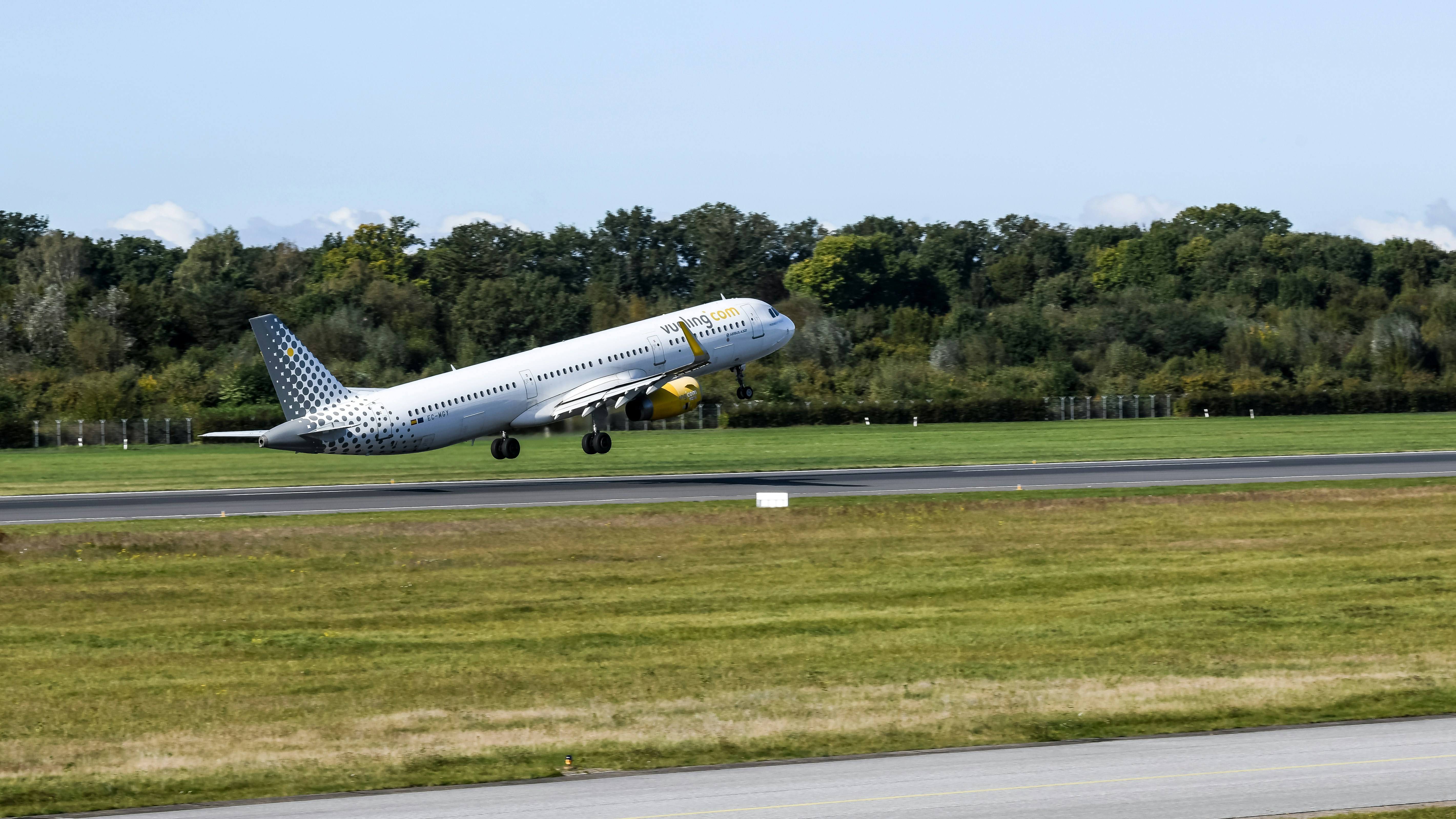 A plane taking off from an airport runway photo – Free Hamburg Image on ...