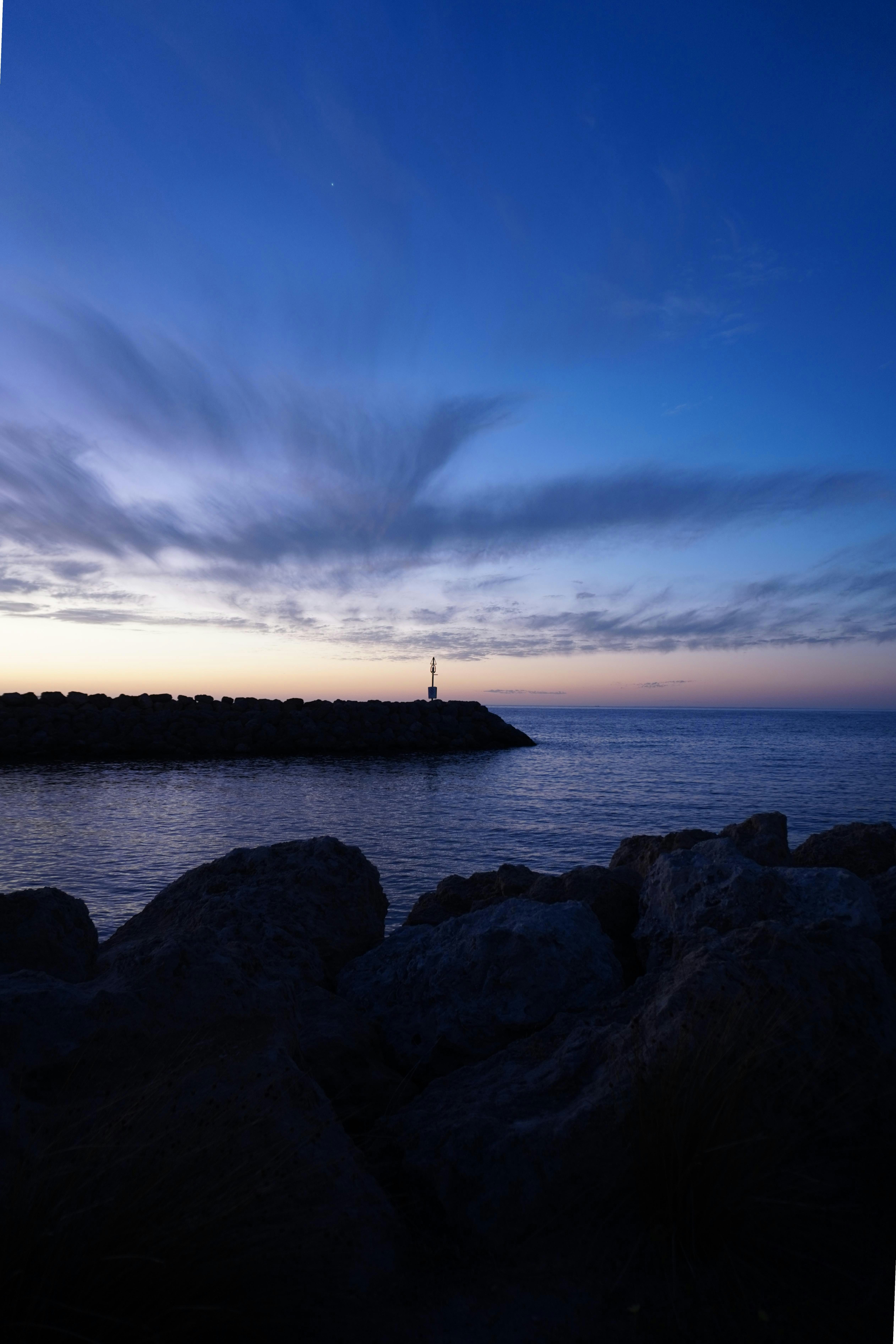 A view of the ocean from a rocky shore photo – Free Coogee marina ...