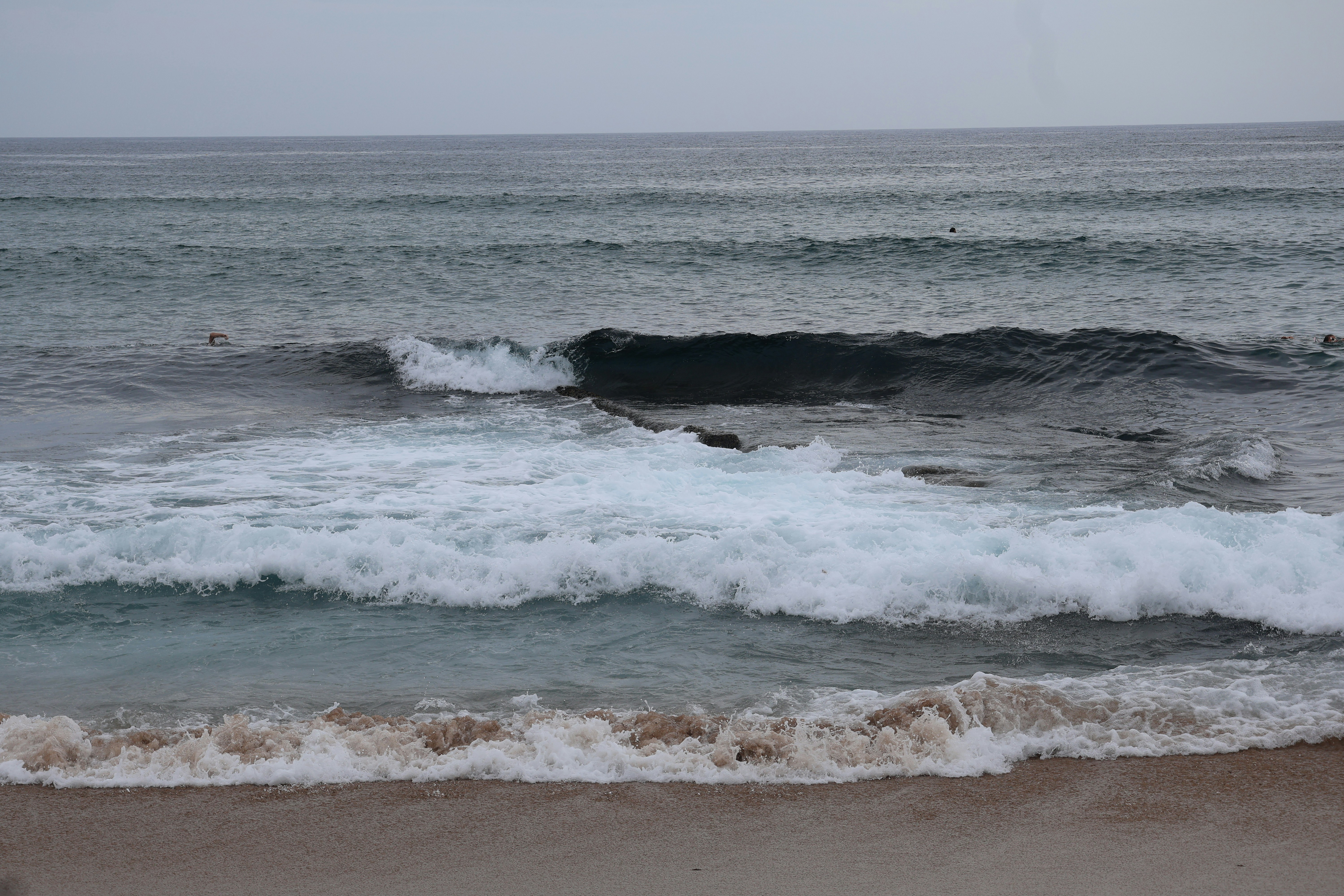 A body of water with waves coming in to shore photo – Free Pumula beach ...