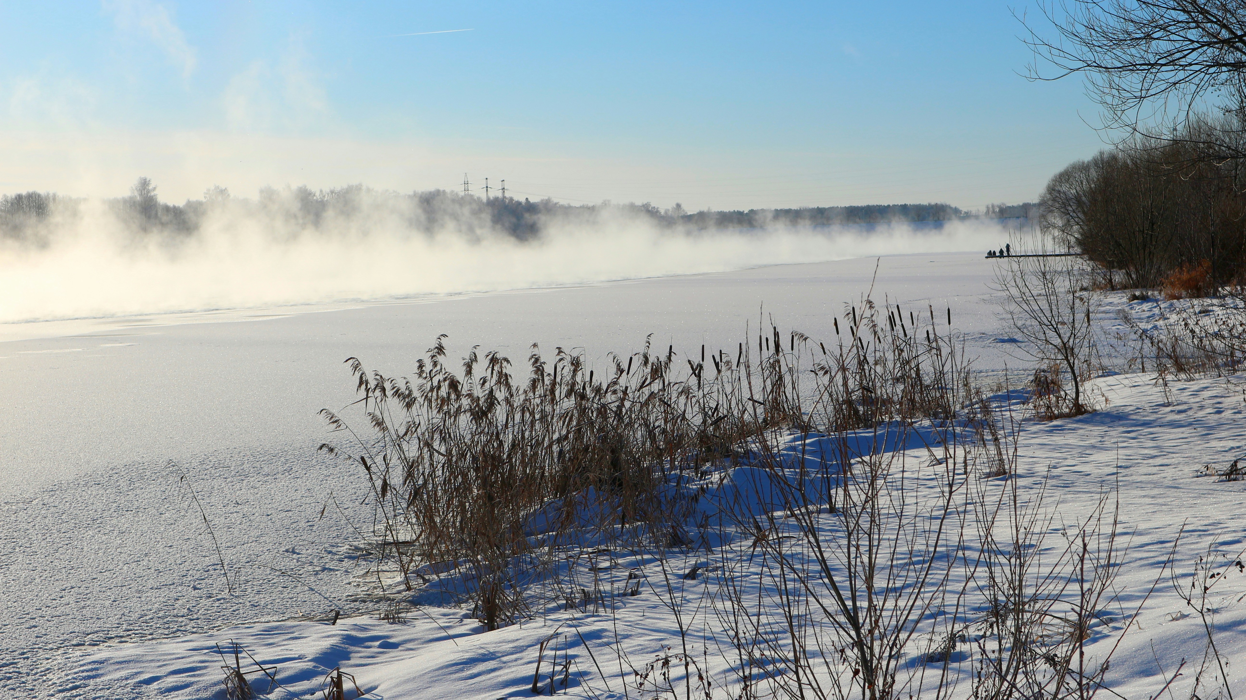 Dawn Mist Rising Over a Snowbound River
