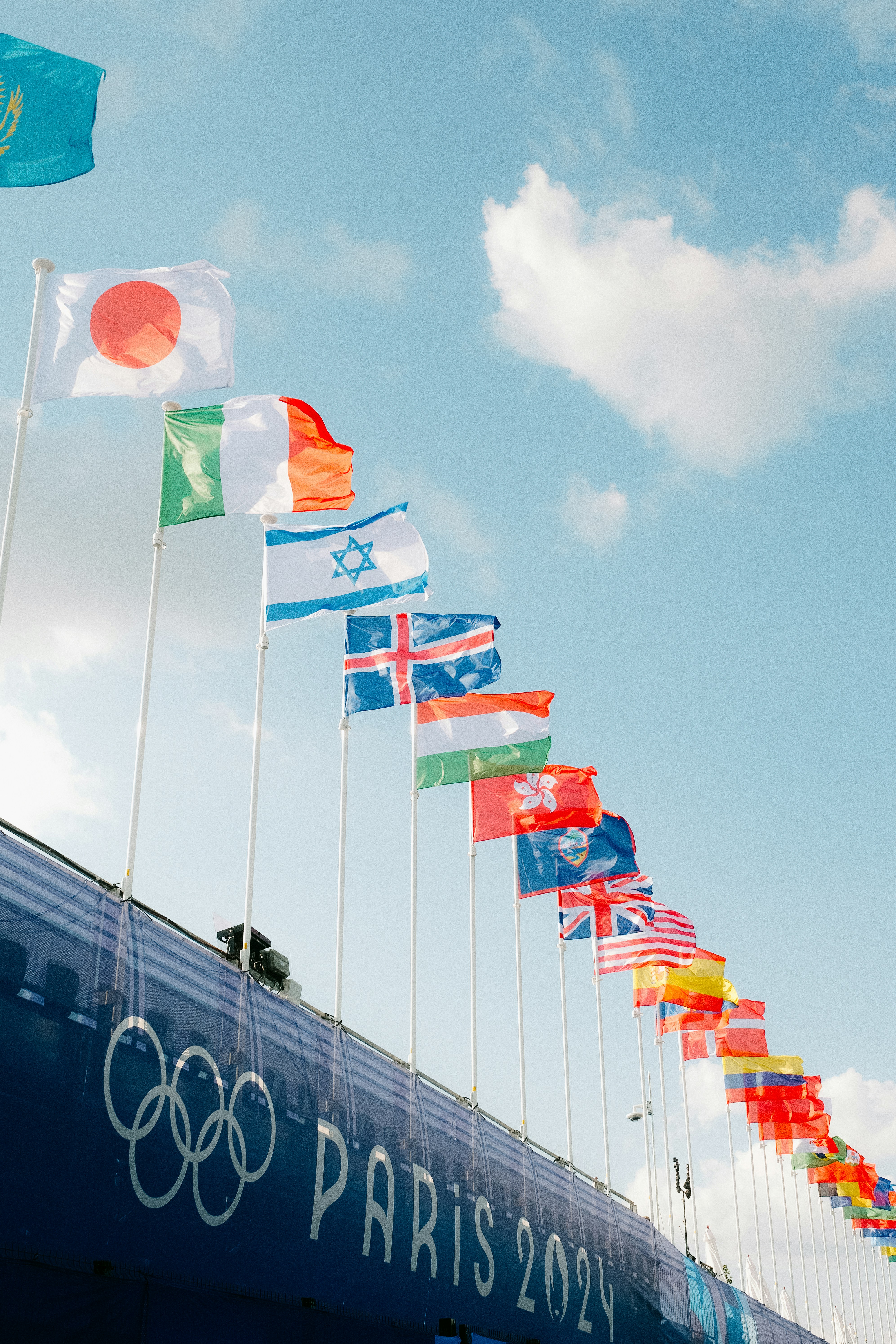 A group of flags flying in the air photo – Free Paris Image on Unsplash
