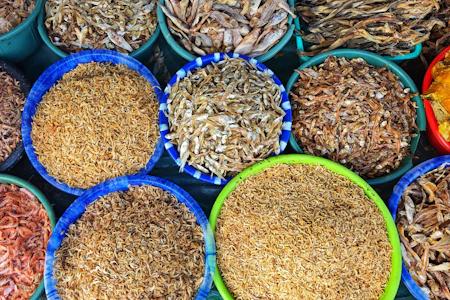 Lime-Green Center: Golden Grains Among a Spicy Rainbow in Circular Bowls