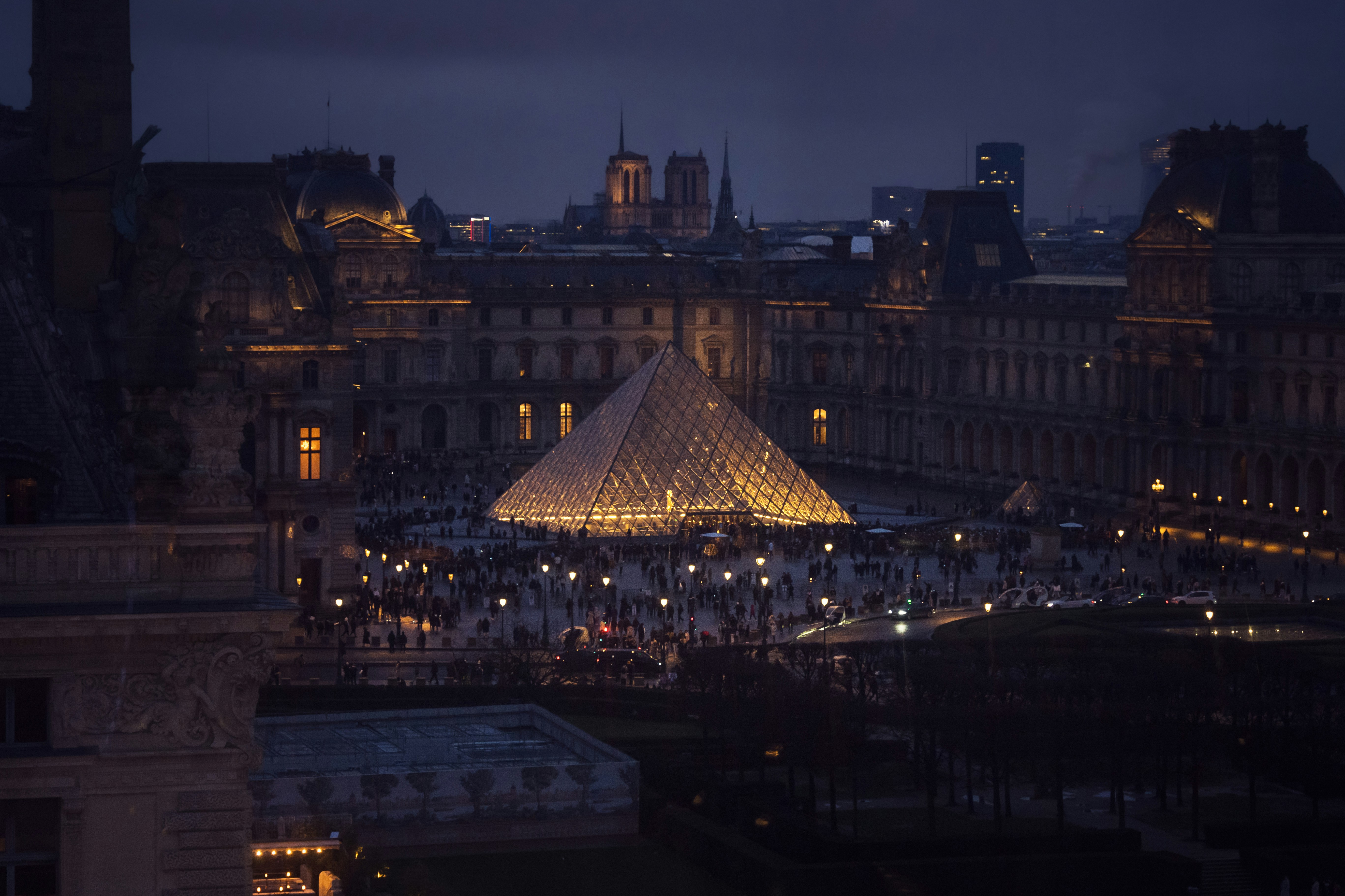 Nocturne at the Louvre: Glass Pyramid Illuminating the Night Facades