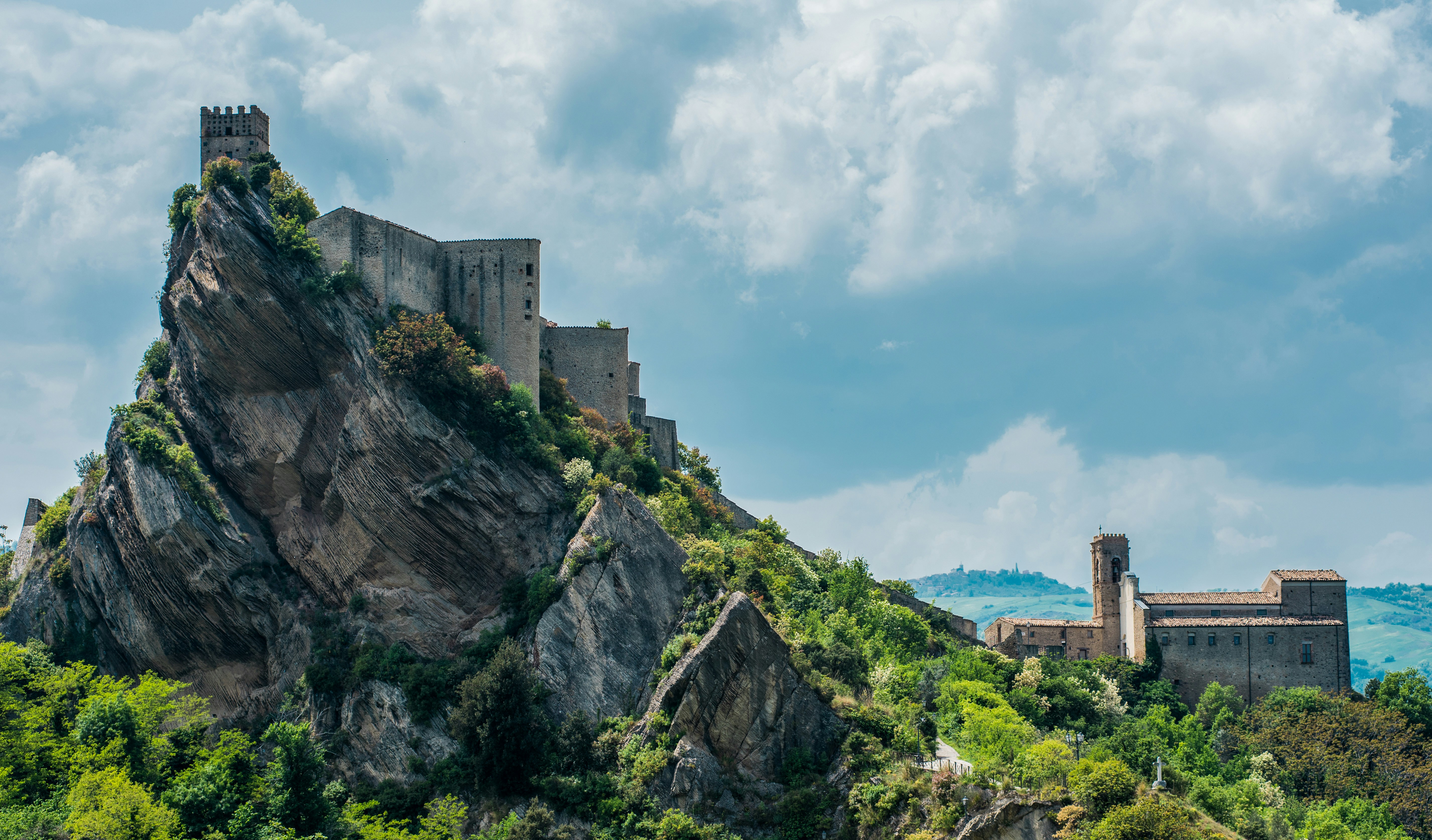 A mountain with a castle on top of it photo – Free Roccascalegna Image on Unsplash