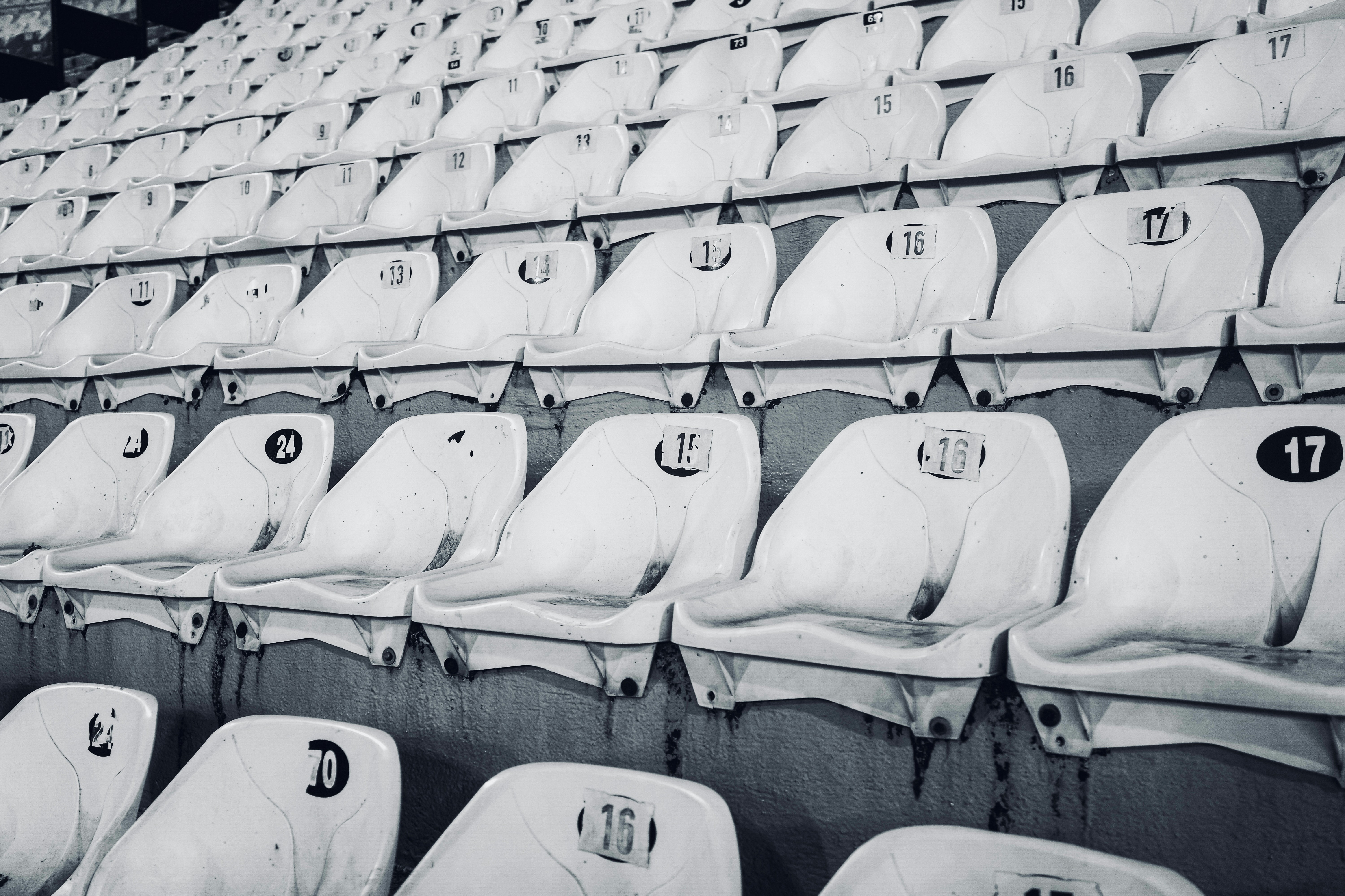A black and white photo of a row of seats photo – Free Human Image on ...