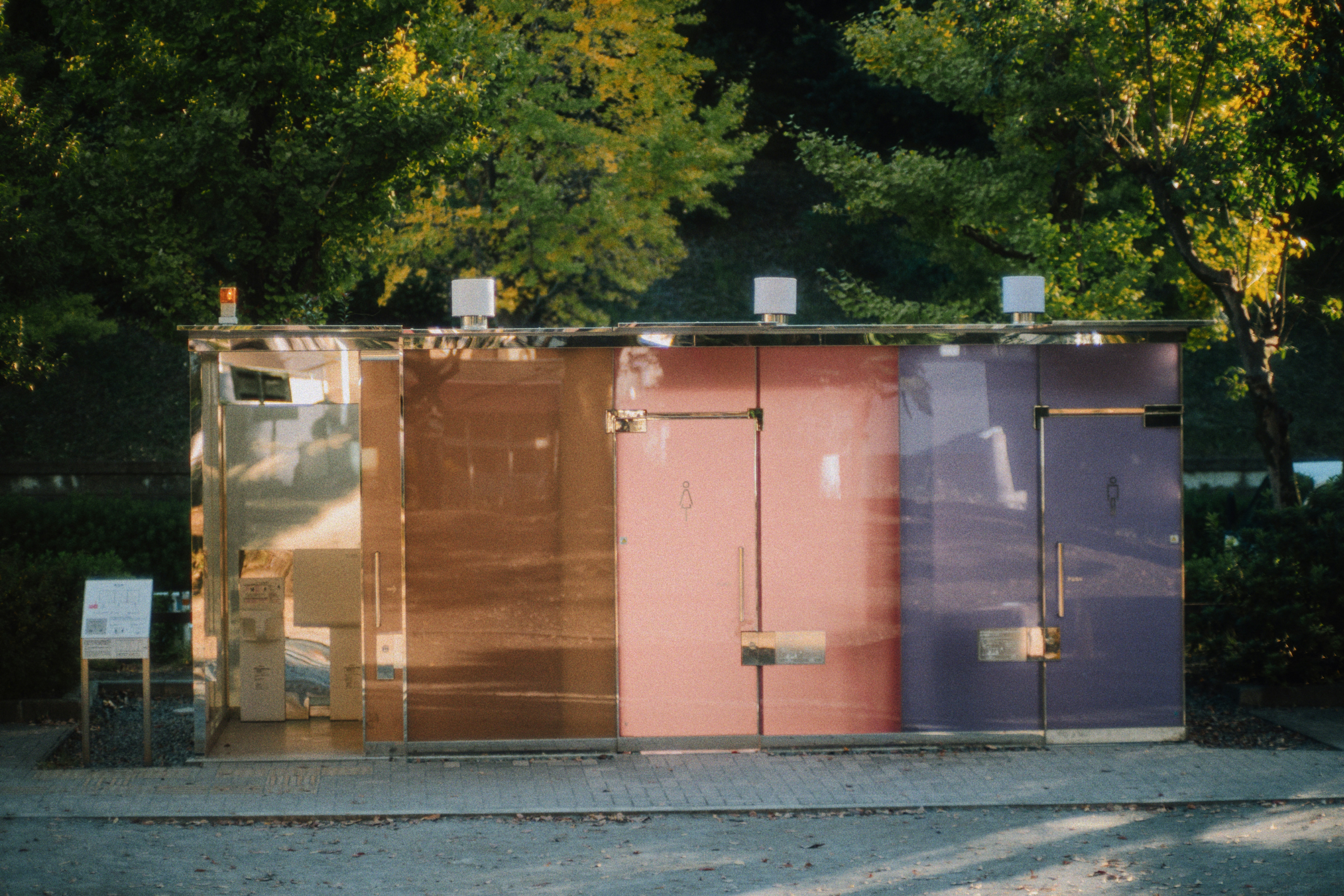 A group of three toilets sitting next to each other photo – Free ...