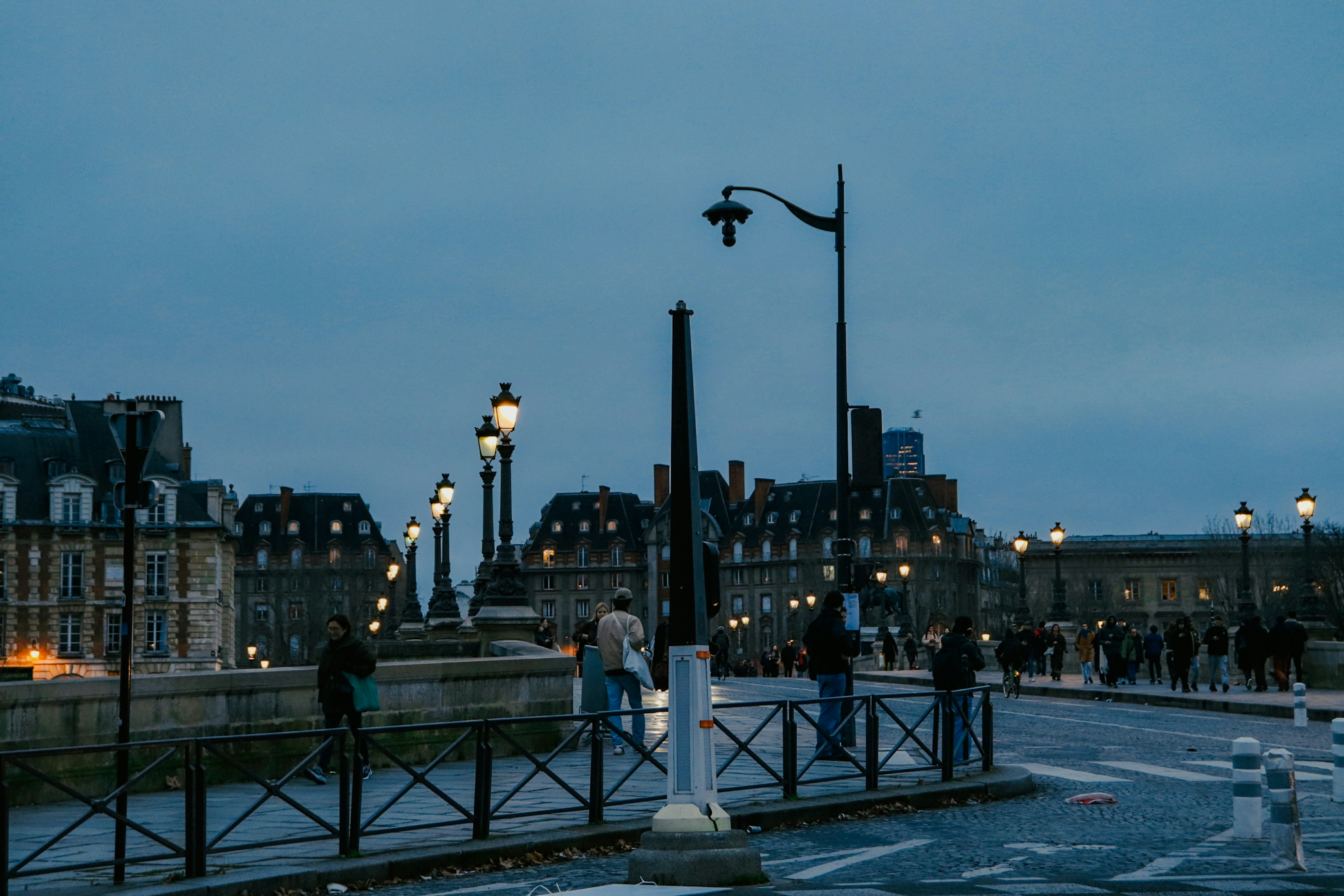 A group of people walking across a bridge at night photo – Free Black ...