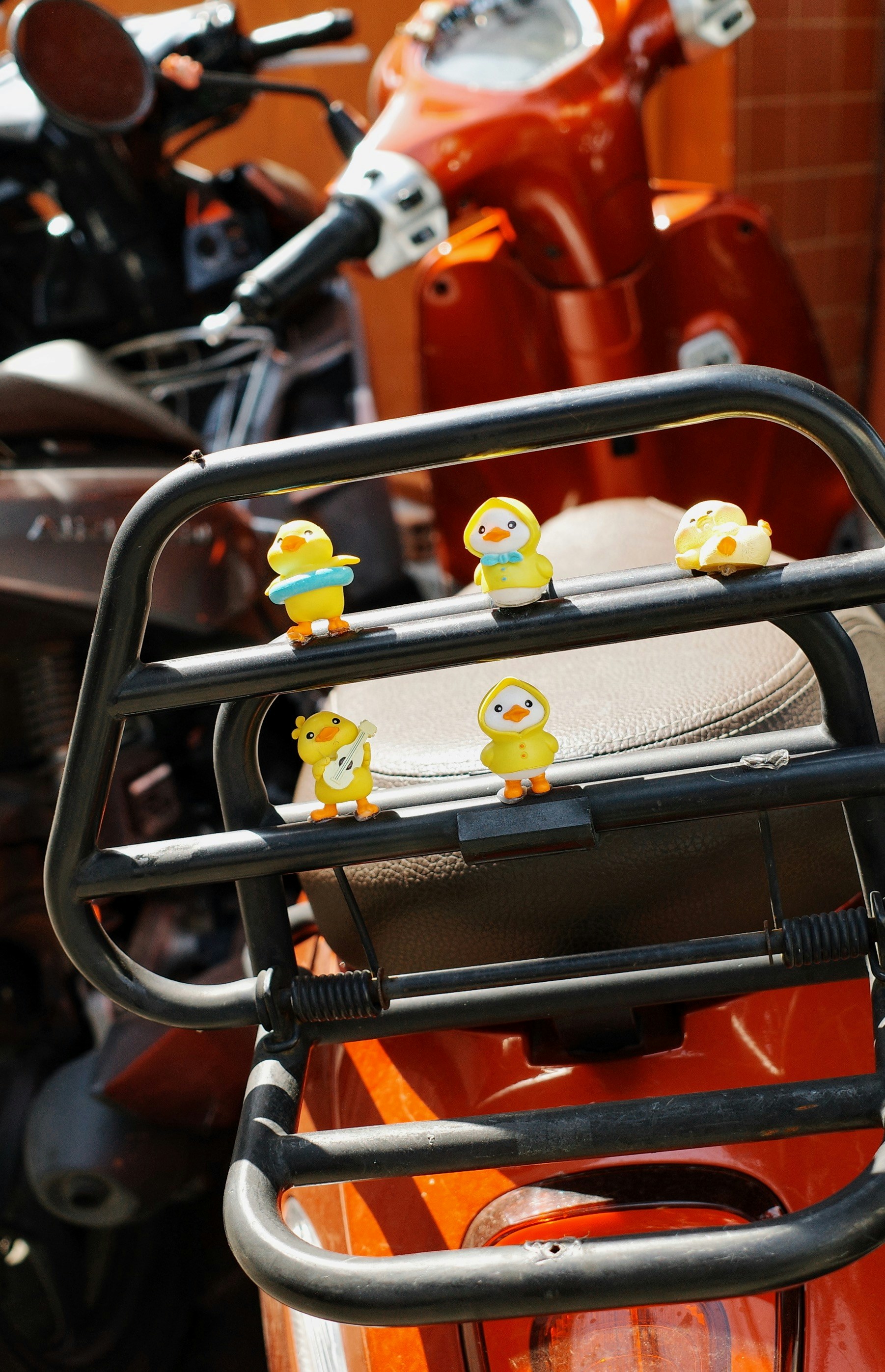A row of parked motorcycles with rubber ducks on them photo – Free Ho ...