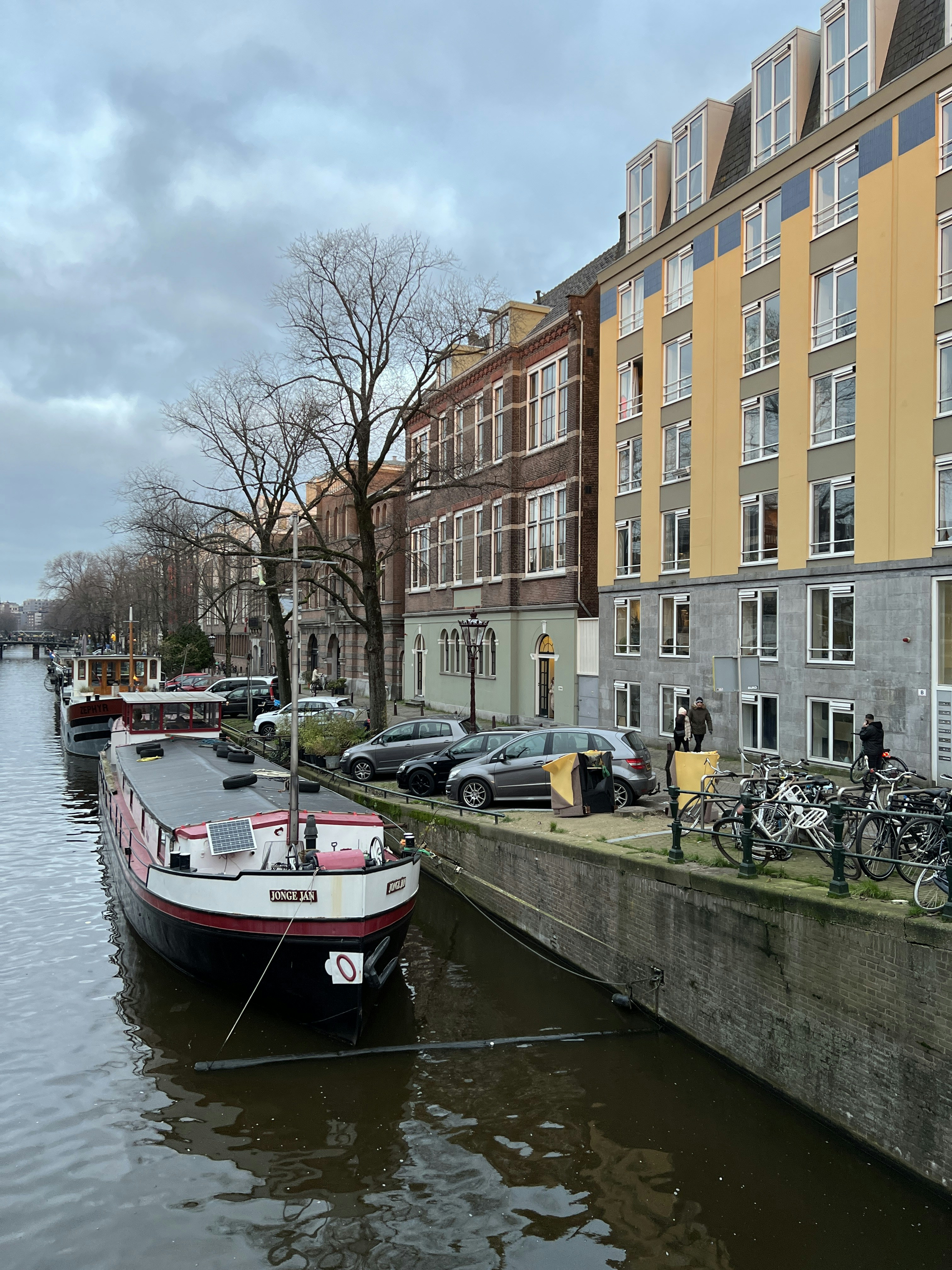 Moored by Colorful Dutch Façades: A Canalfront Scene