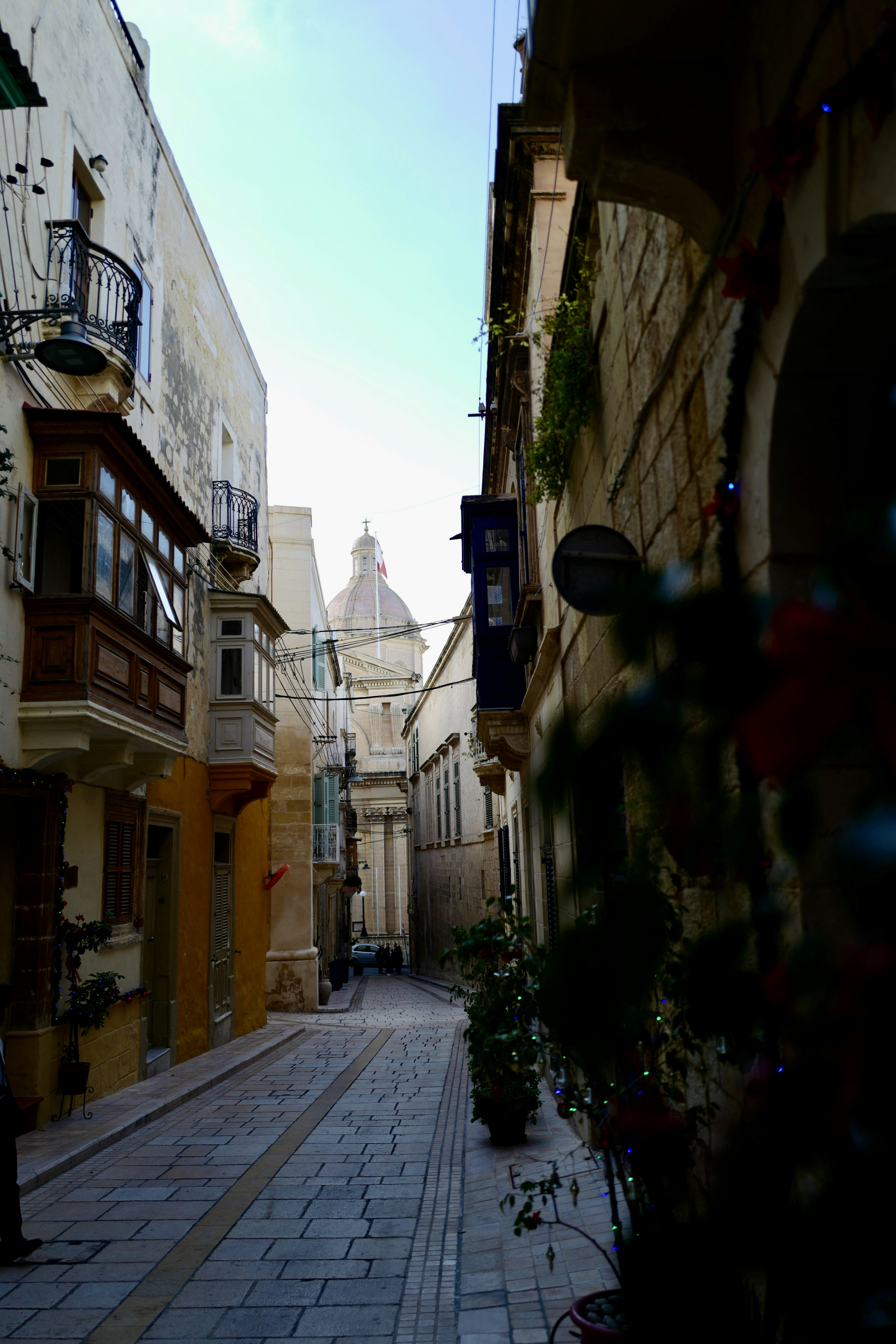 Cobbled Alley Toward a Dome-Molded Sky
