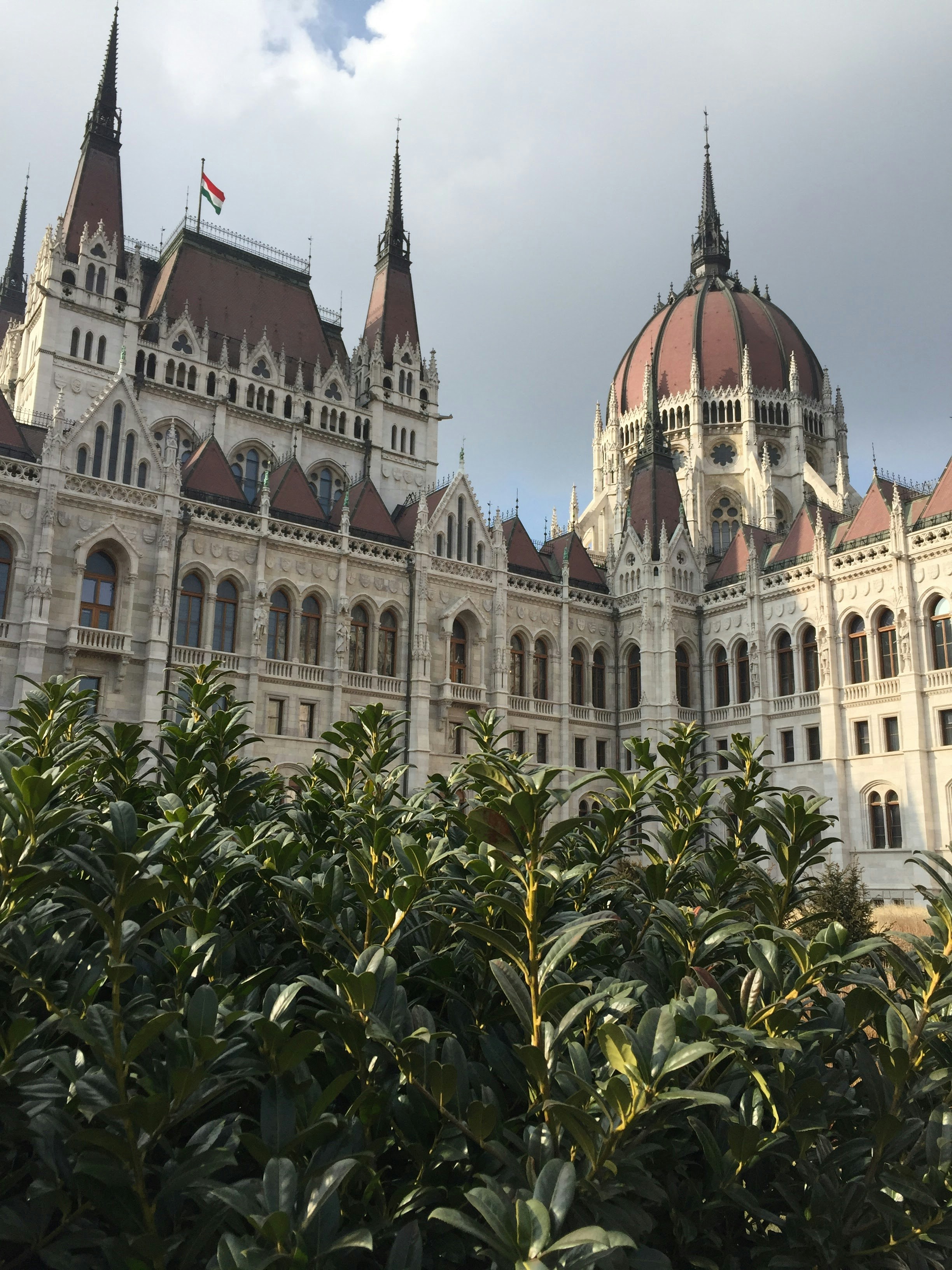A large building with a clock on the front of it photo – Free Budapest ...