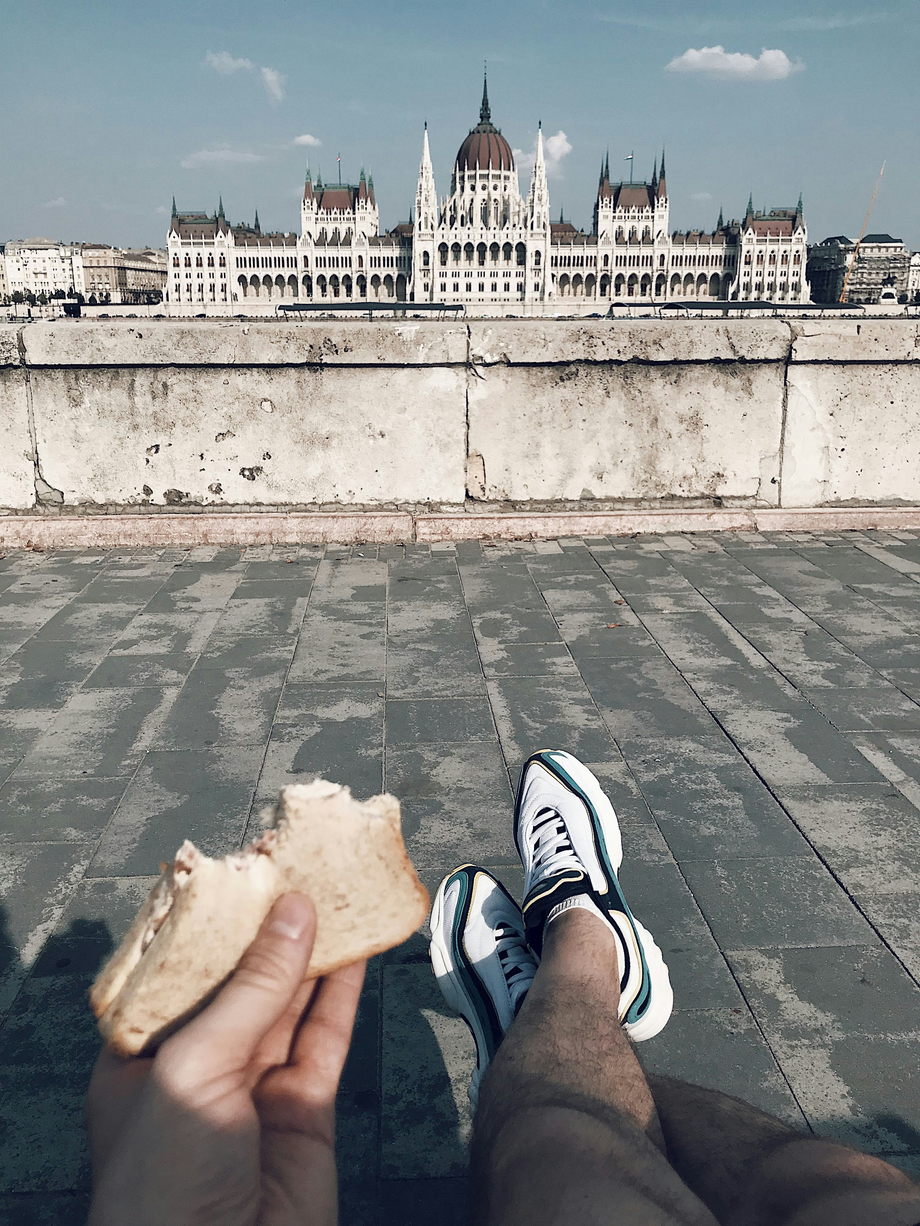 Pause on the Danube: sneakers, bread, and the Parliament's silhouette