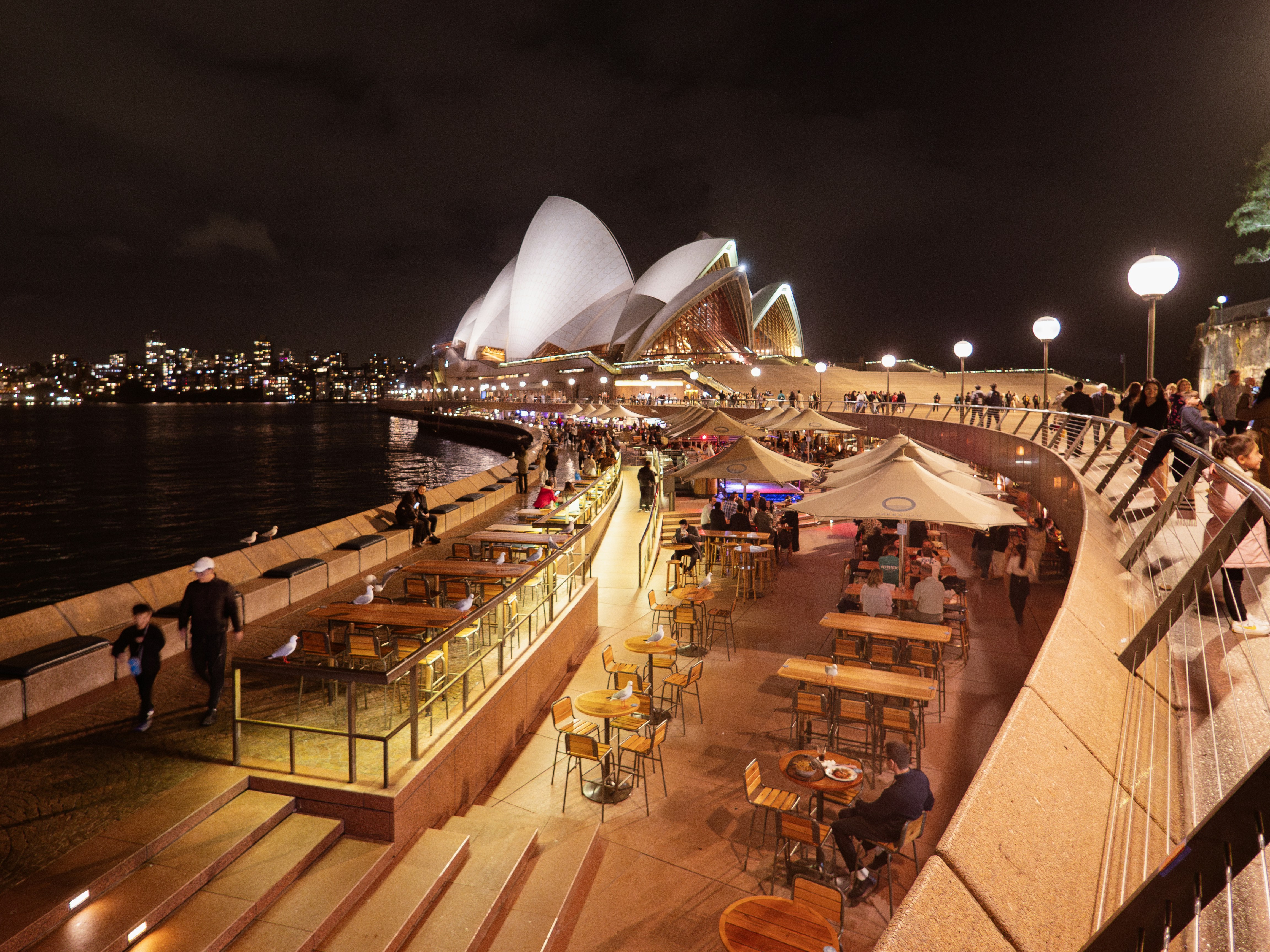 Harbour Lights and Sails: Dining Terrace Beneath Sydney Opera House at Night