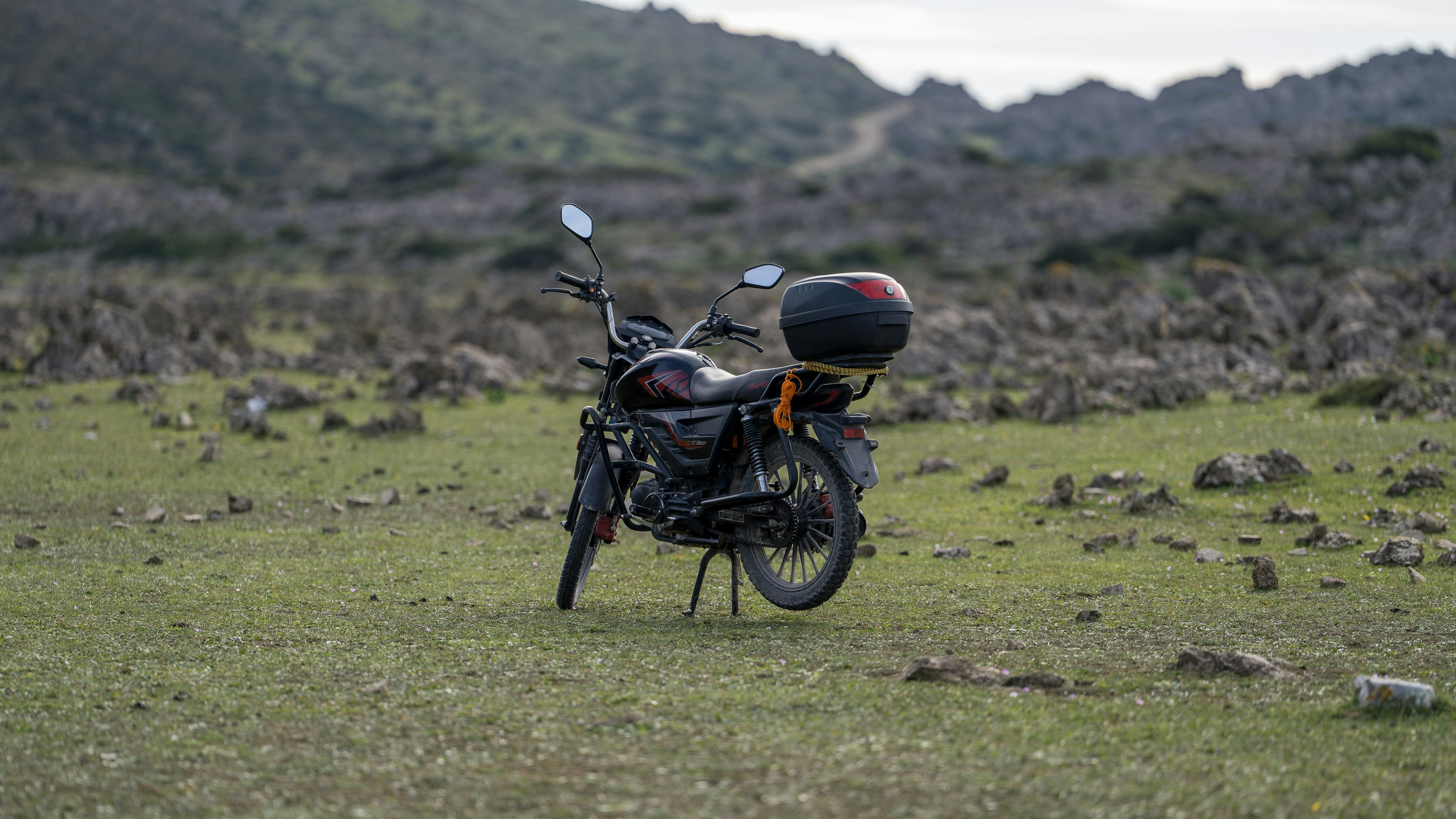 Lone Moto on a Lava-Field Frontier