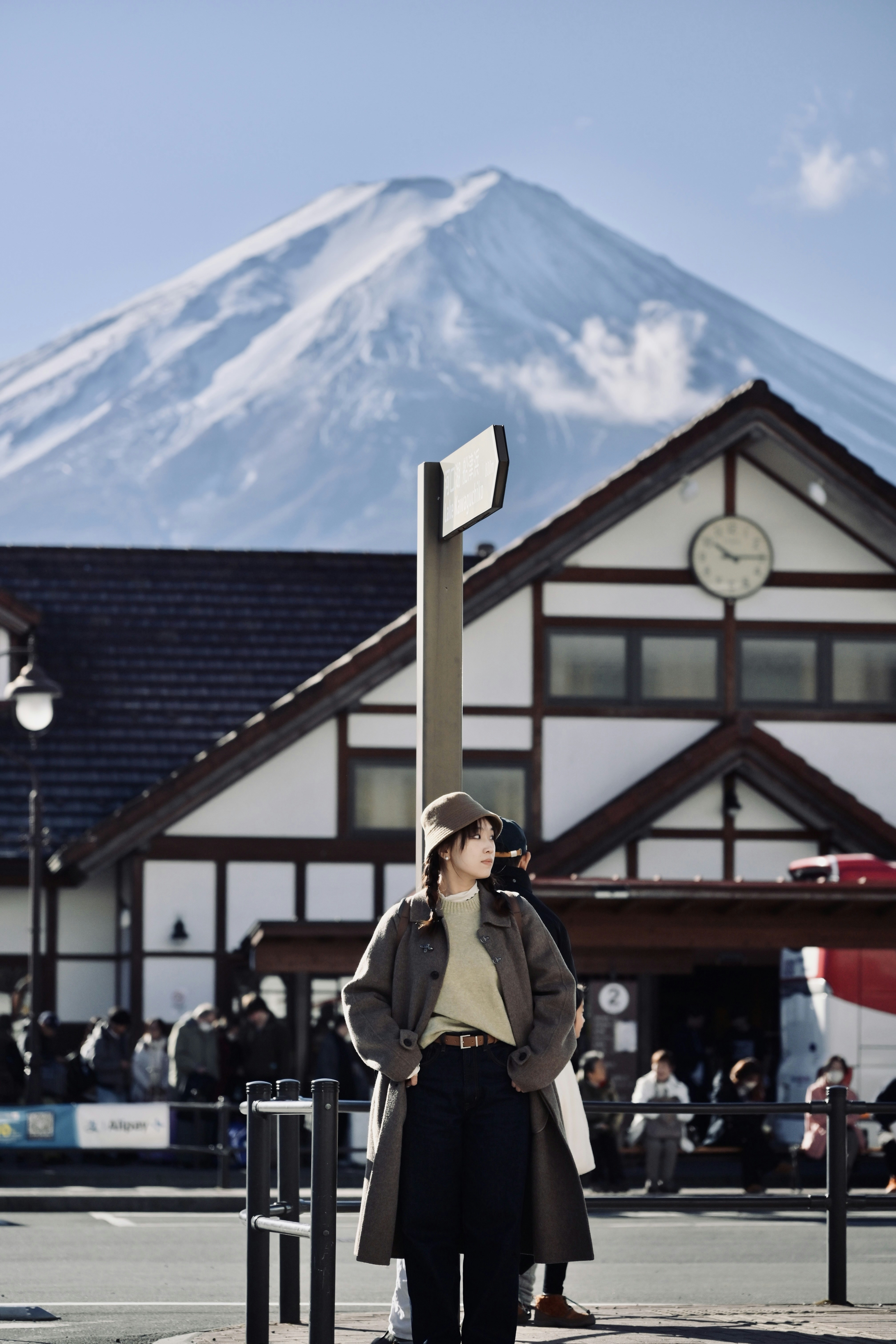 Portrait on Fuji Backdrop: A Street Moment with a Camera