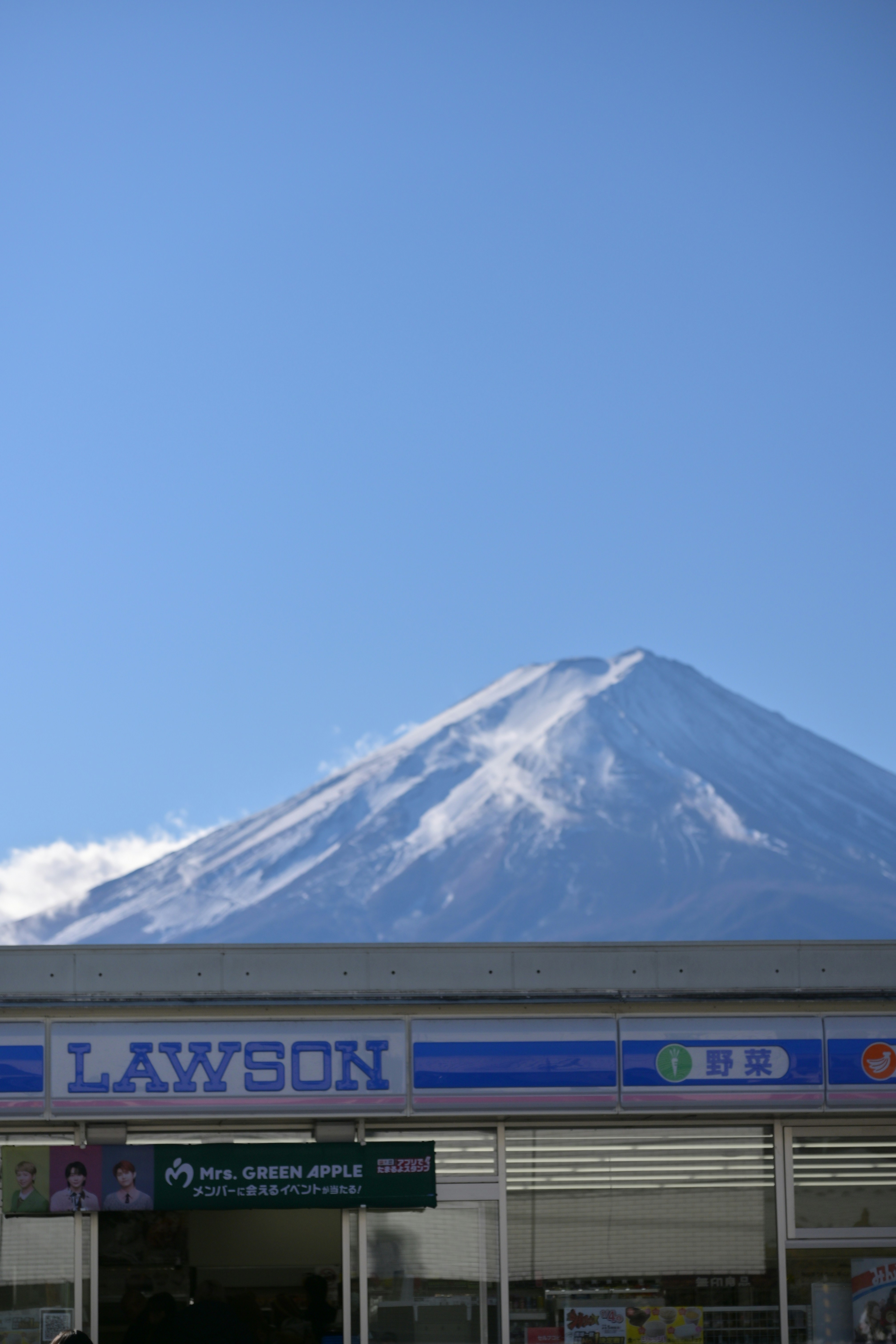 Snow-Capped Peak Over a Diner Rooftop
