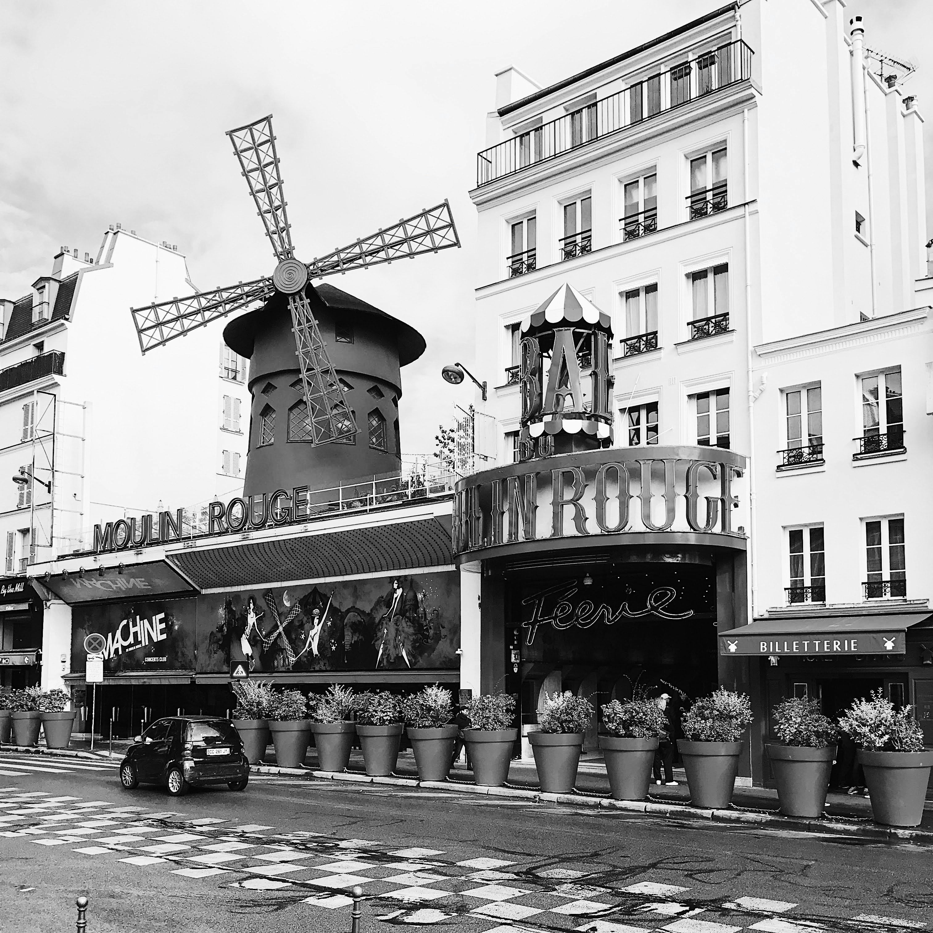 Paris Noir: The Moulin Rouge Windmill Crowned by a Monochrome Street