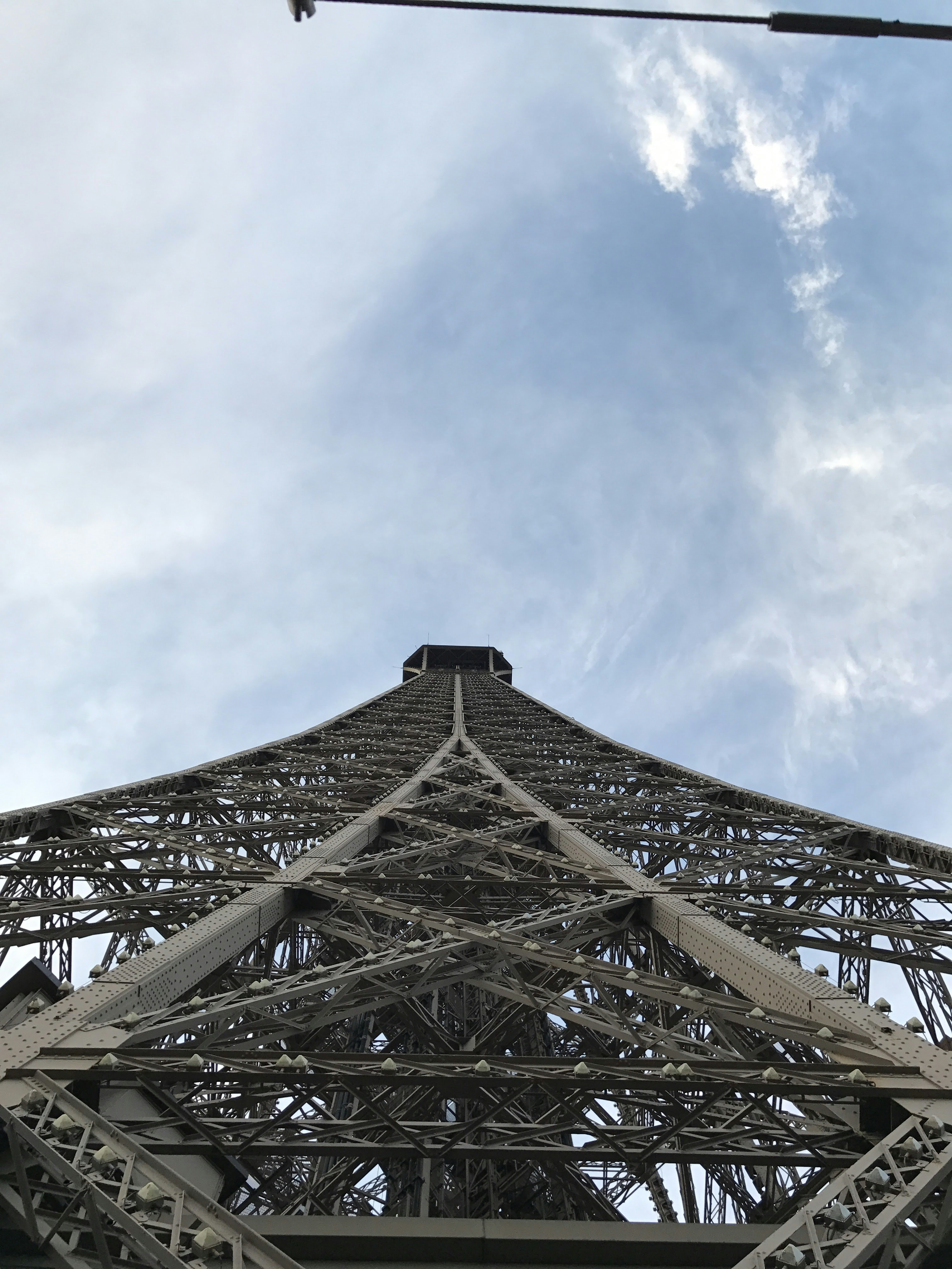 Iron Constellation: Upward Crisscross of a Tower's Steel Frame