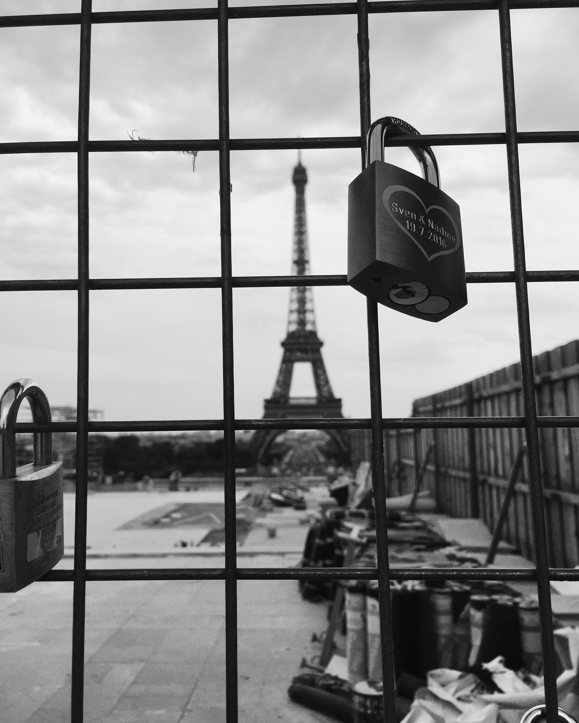 Through the Grid: Eiffel Tower framed by a ring of love locks