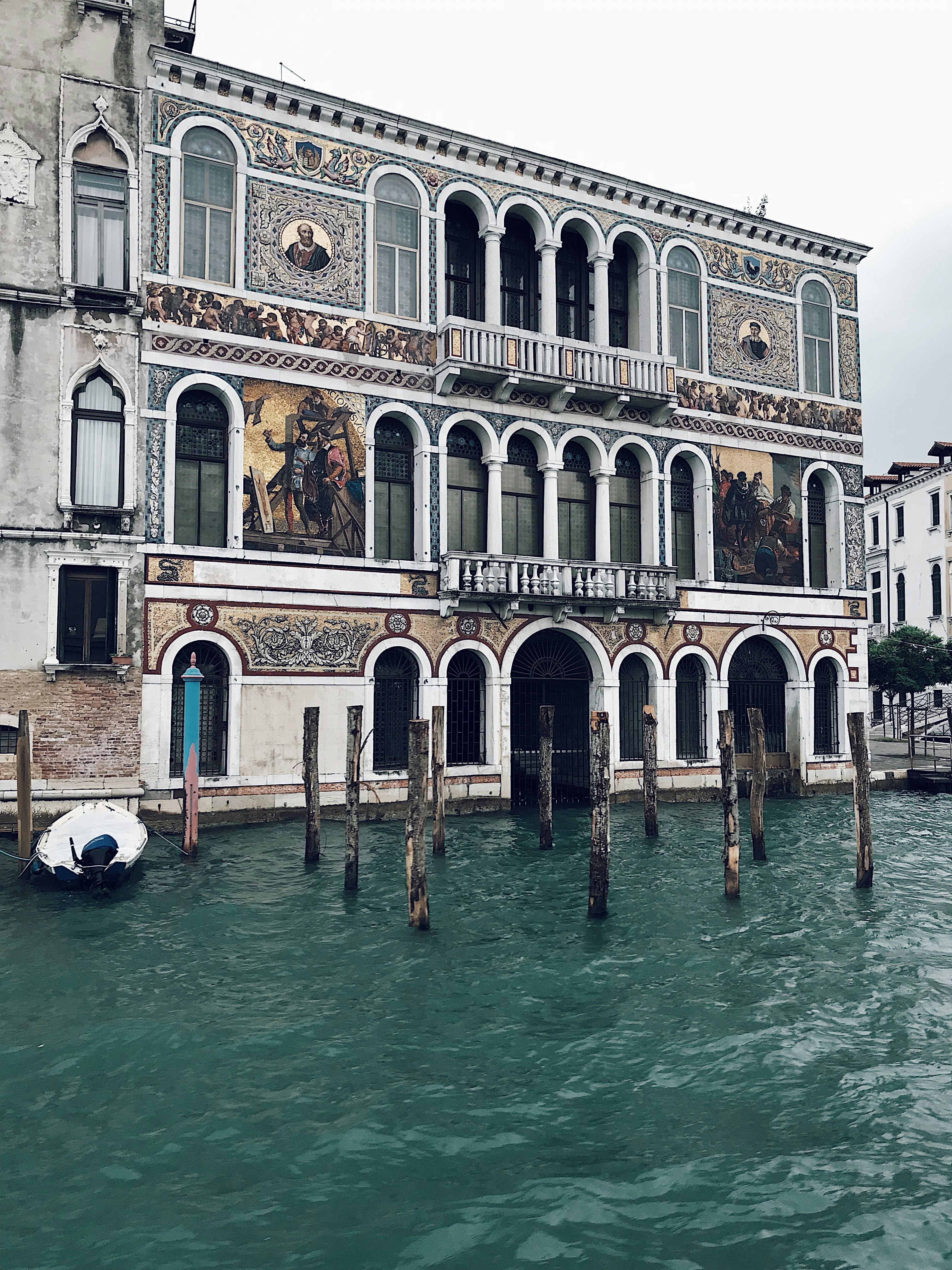 Canalfront Palazzo: Mosaic Facades and Arched Arcades of Venice