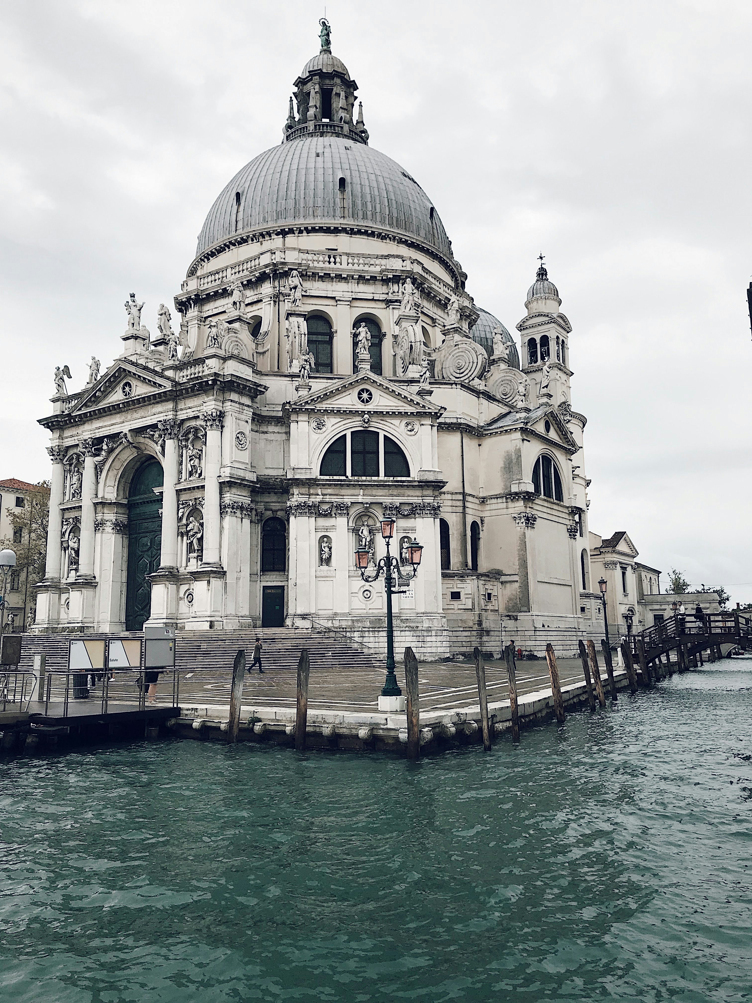 Salute on the Canal: Venice's Marble Dome Rising Over Water