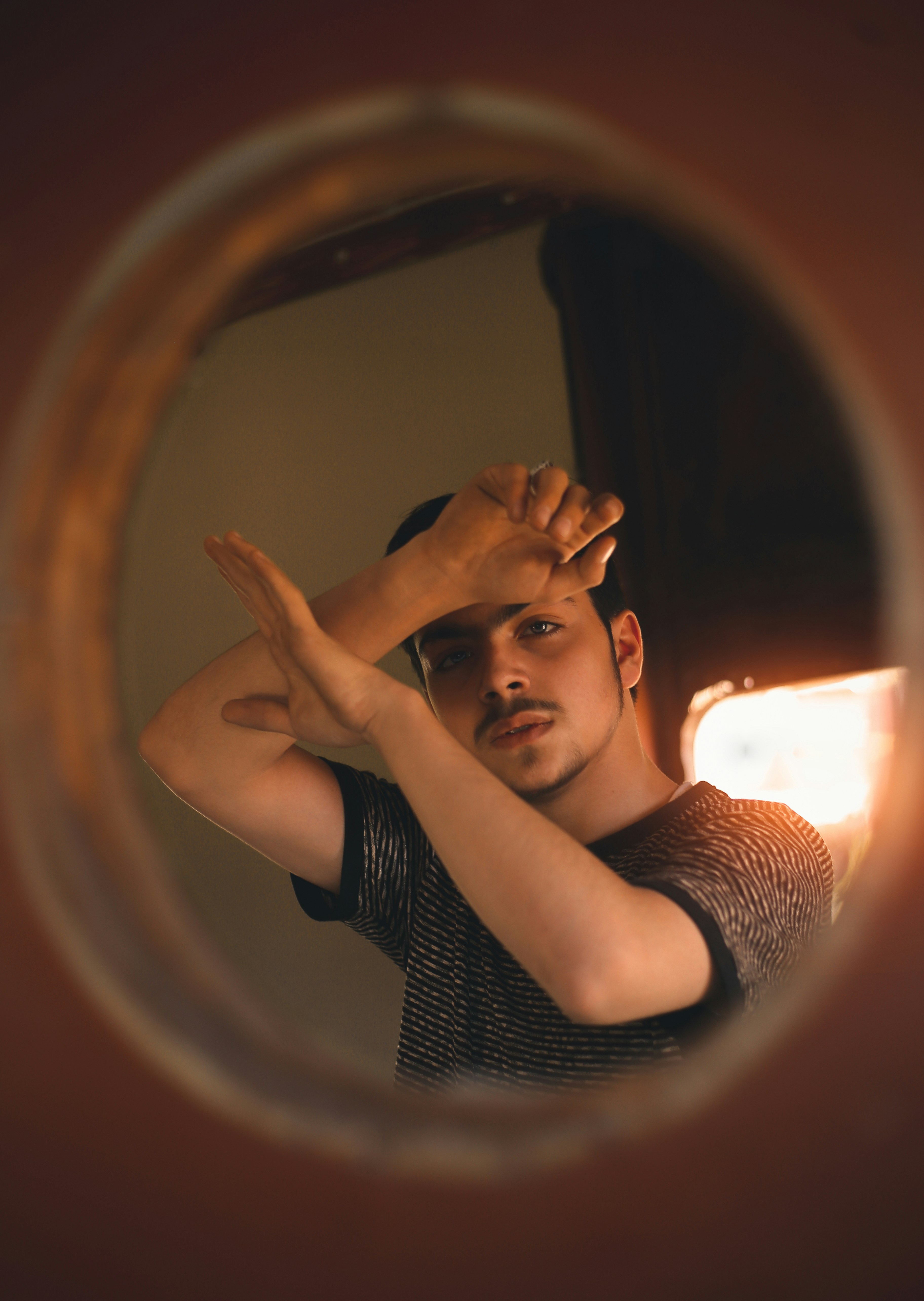 A man standing in front of a mirror photo – Free Naeem ad studios Image on Unsplash