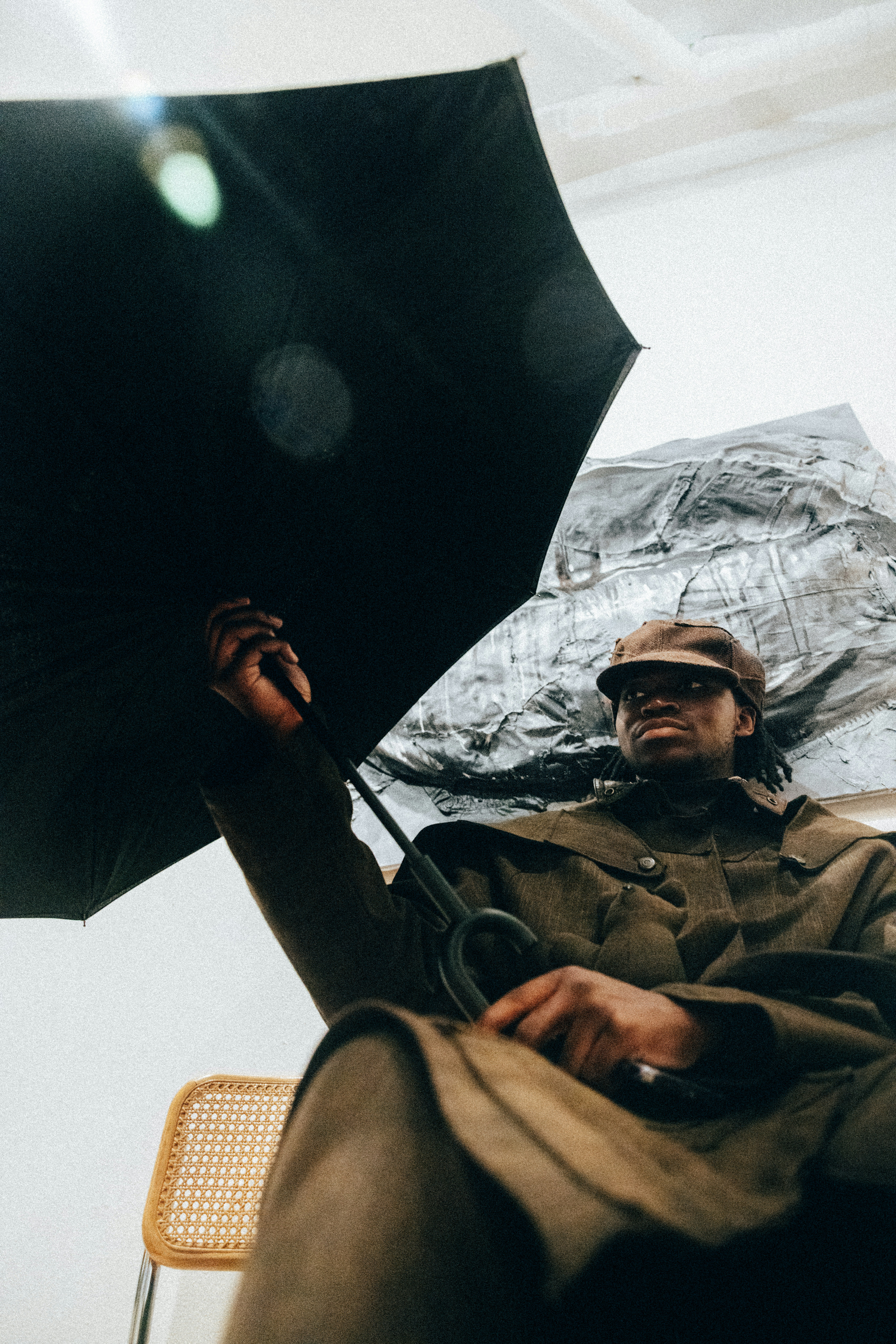 Enigmatic Gaze Beneath the Umbrella