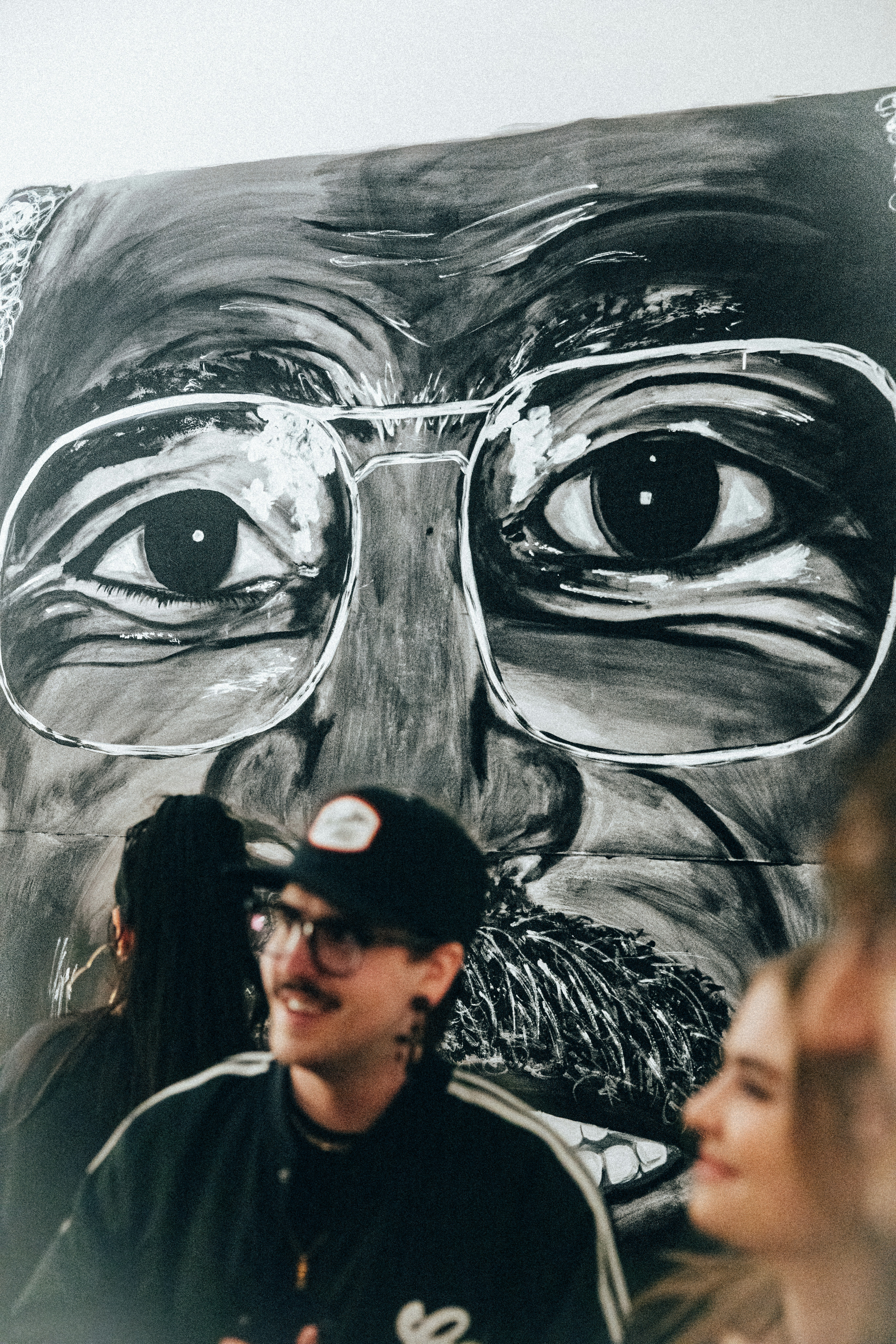 Giant Glasses, City Gaze: A Graffiti Portrait Framed by Motion