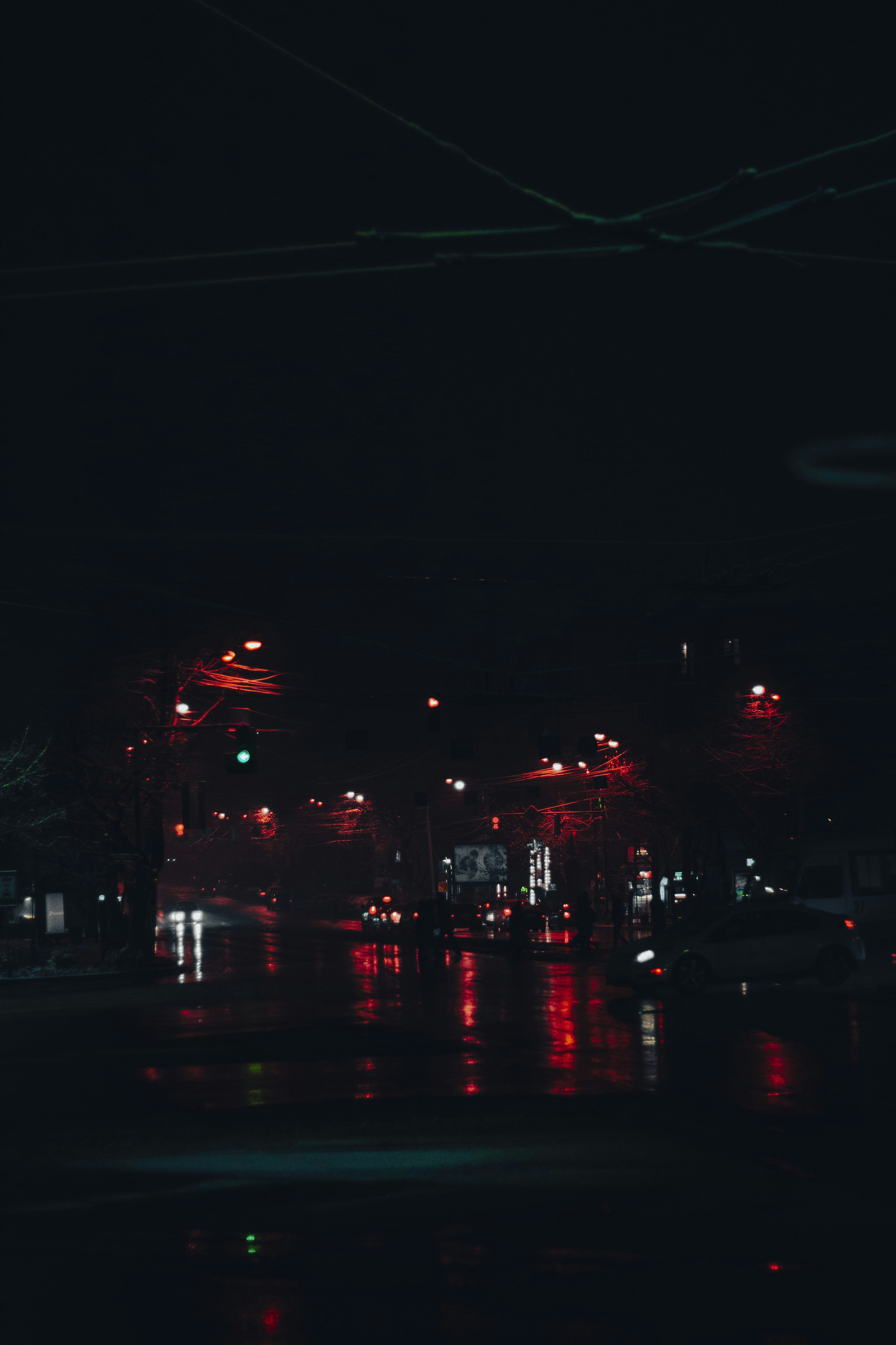 A city street at night with a lot of lights