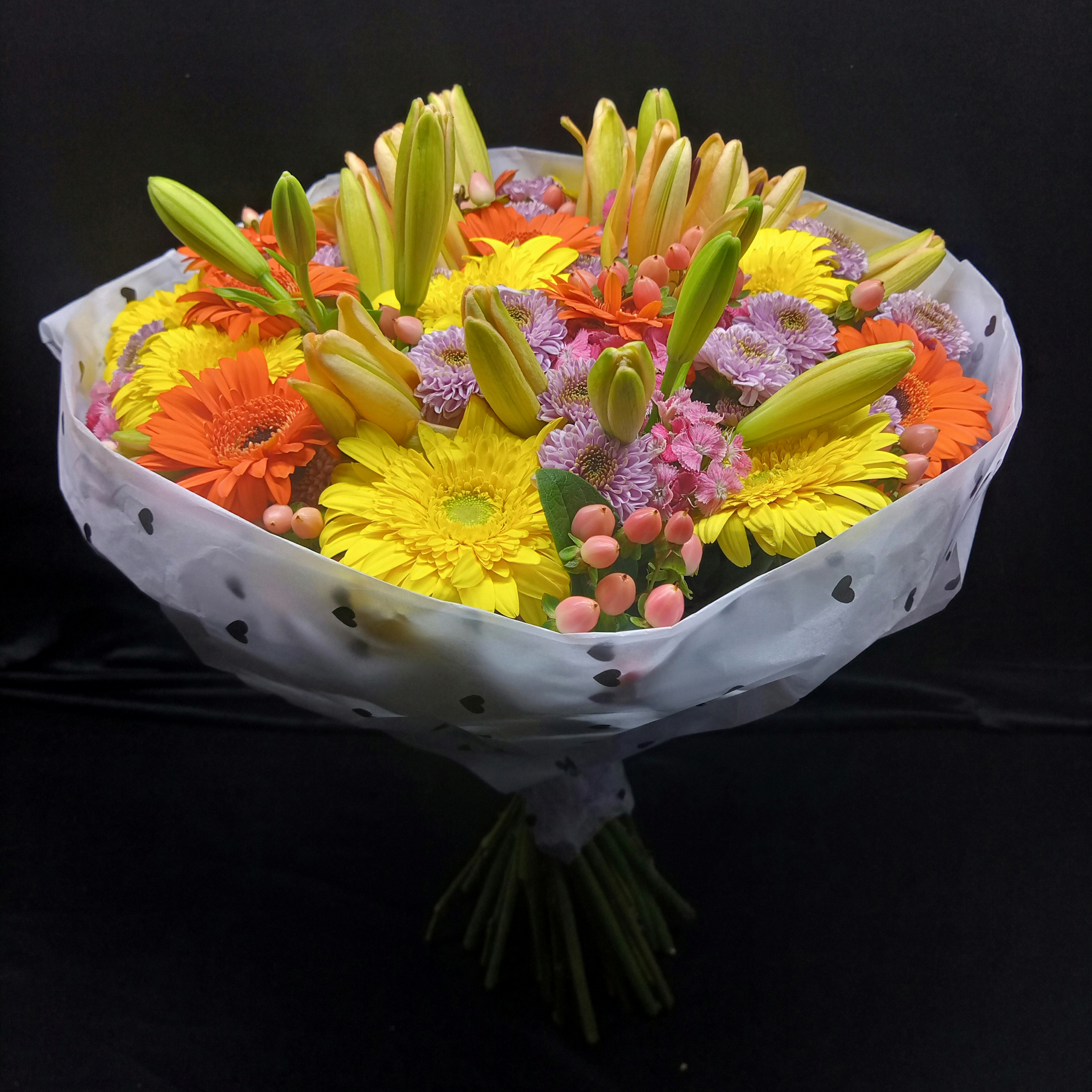 A bouquet of flowers sitting on top of a table