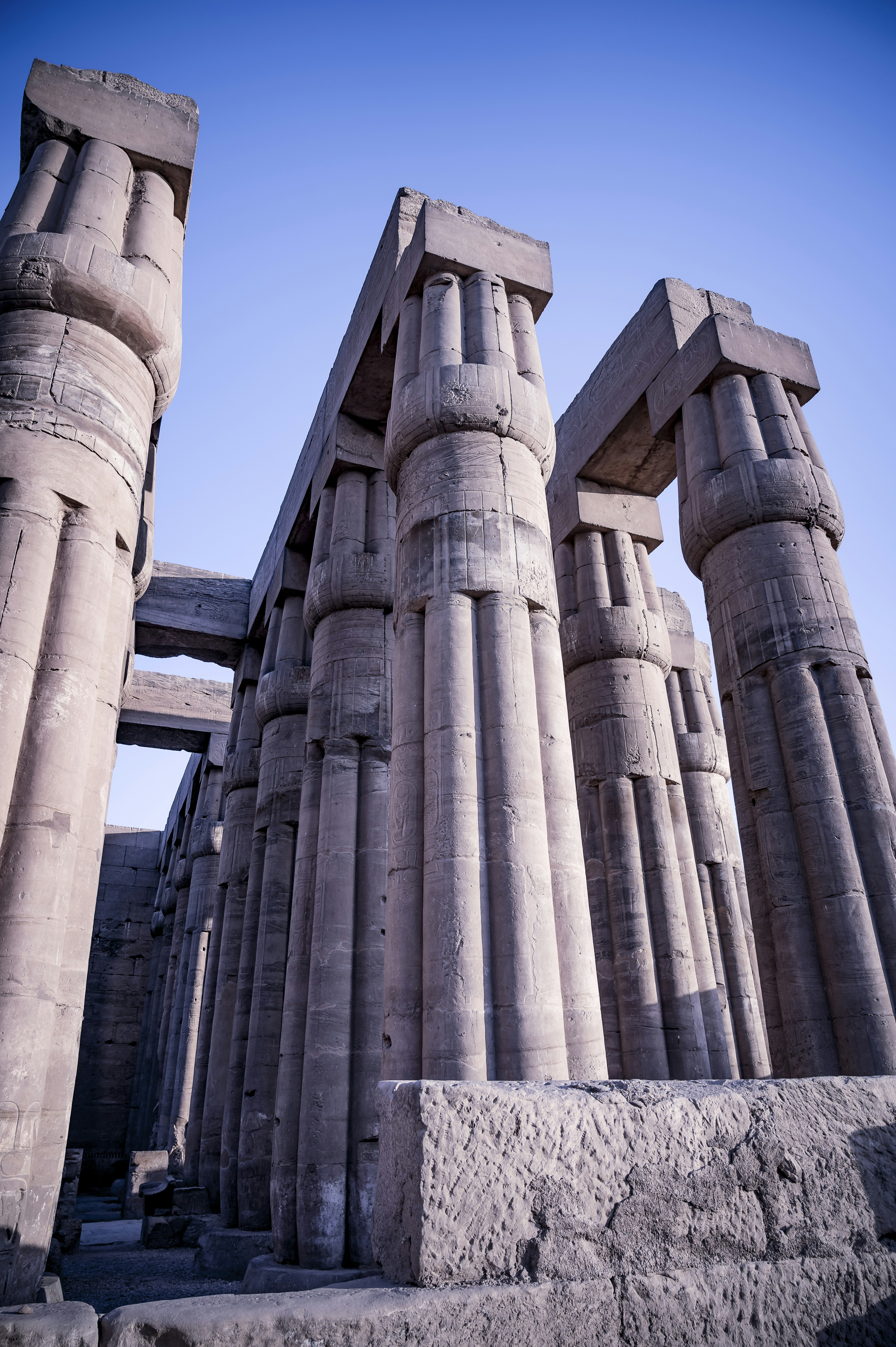 A group of stone pillars sitting next to each other photo – Free ...