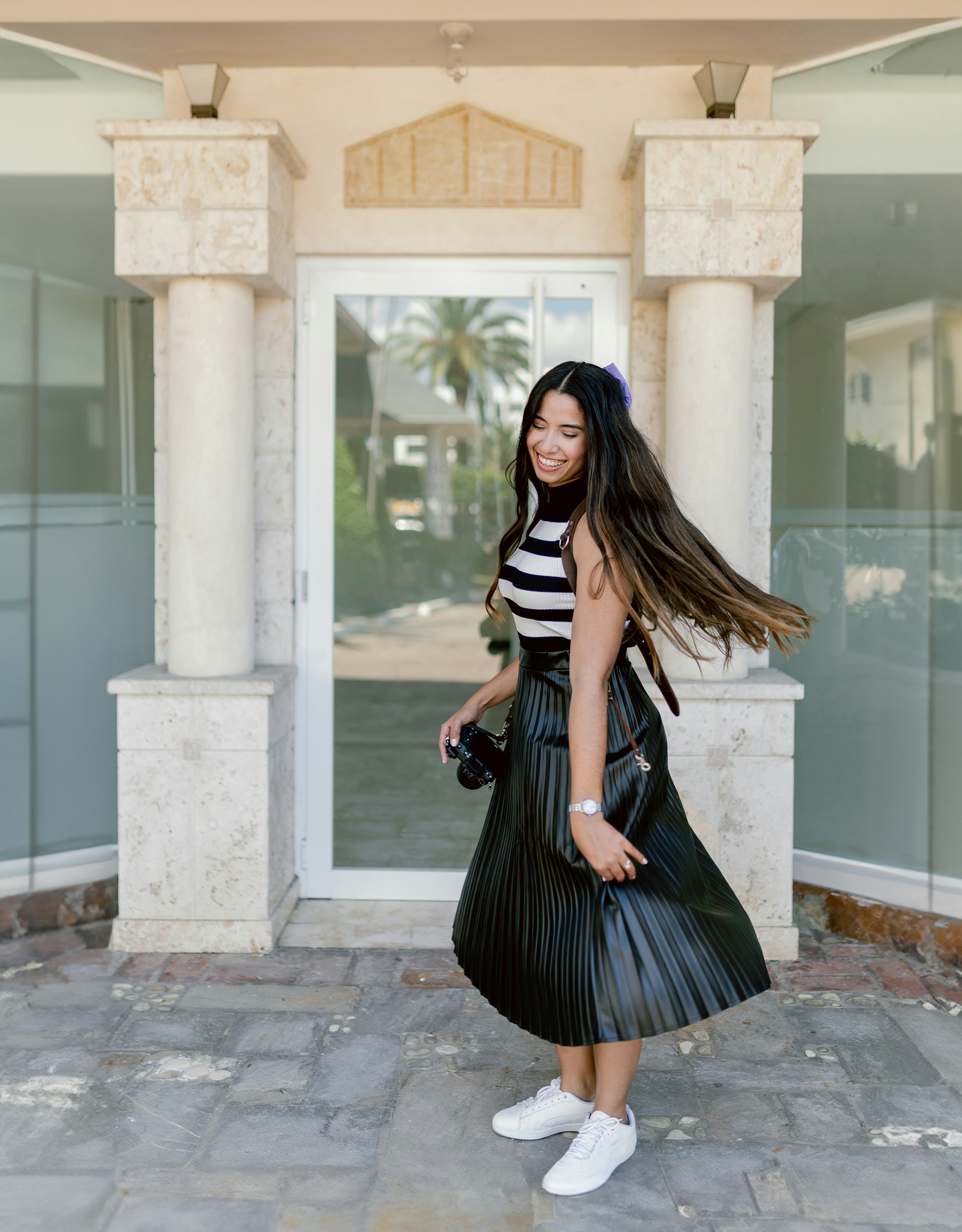 Stride and Smile: Portrait under a Marble Portal