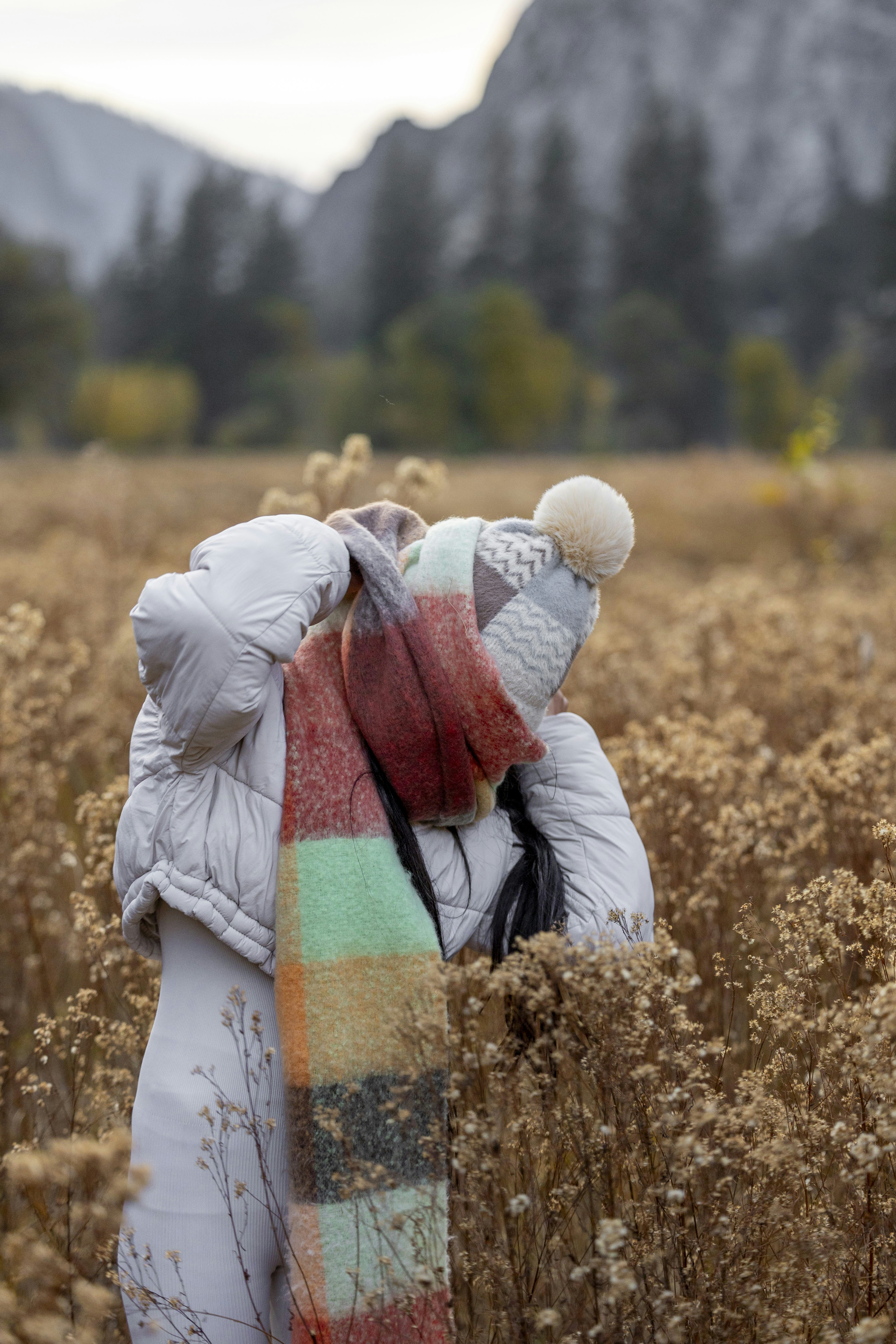 A Hug in the Golden Field: Multicolor Scarf Draped Over a Winter Coat