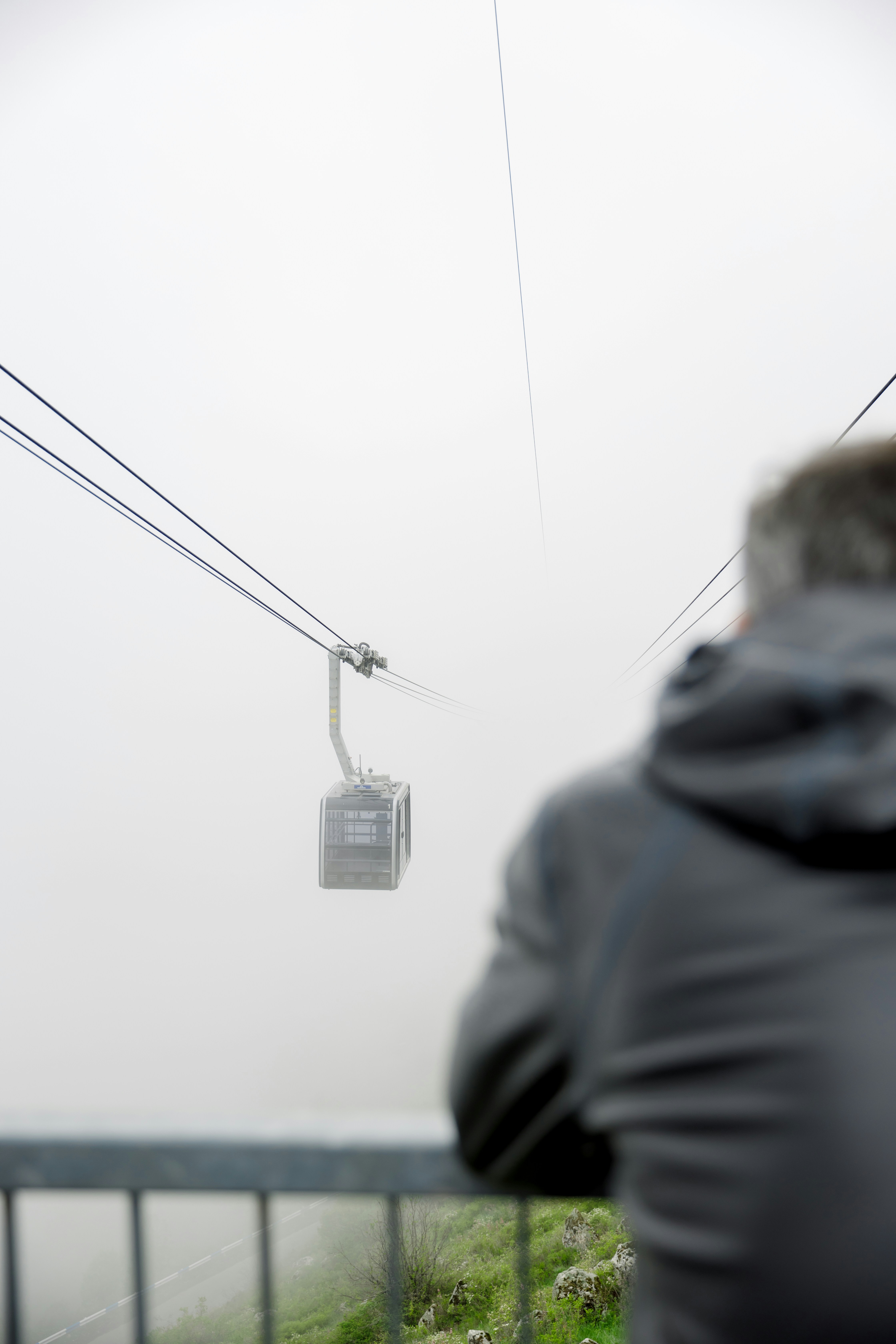 Mistbound Ascent: A Cable Car Drifts Through Silence